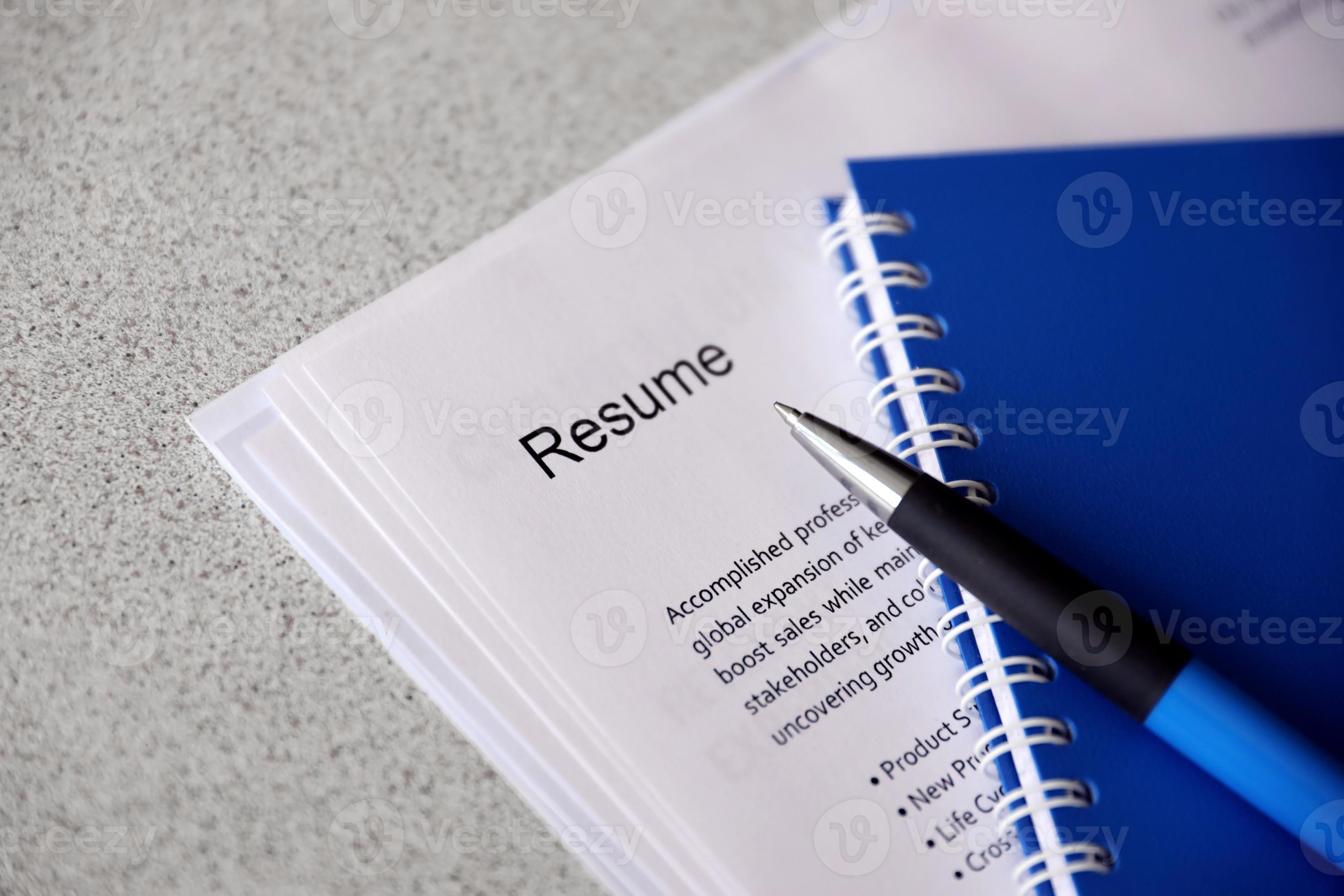 Top view of stack of office documents including resume and cv forms on ...