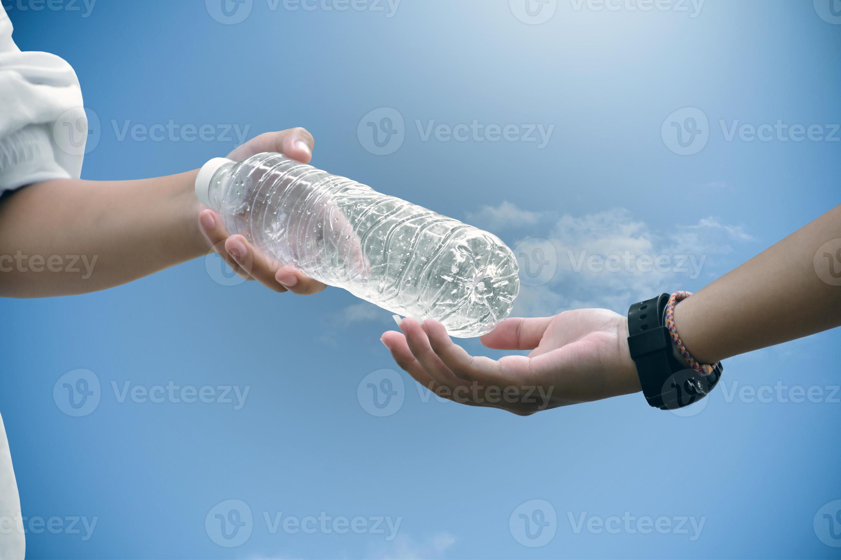 Giving plastic bottle to make recyclying, reusing and reducing objects ...