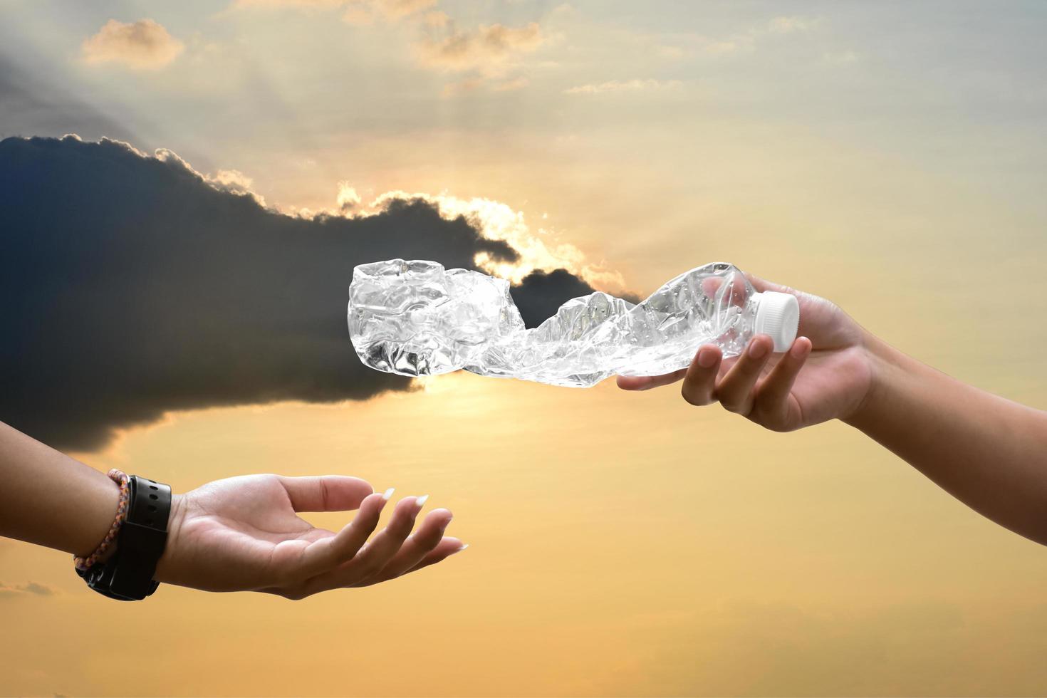 Giving Plastic Bottle To Make Recyclying Reusing And Reducing Objects To Lower Garbage And To