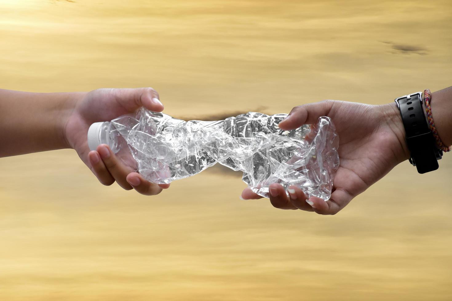 Giving Plastic Bottle To Make Recyclying Reusing And Reducing Objects To Lower Garbage And To