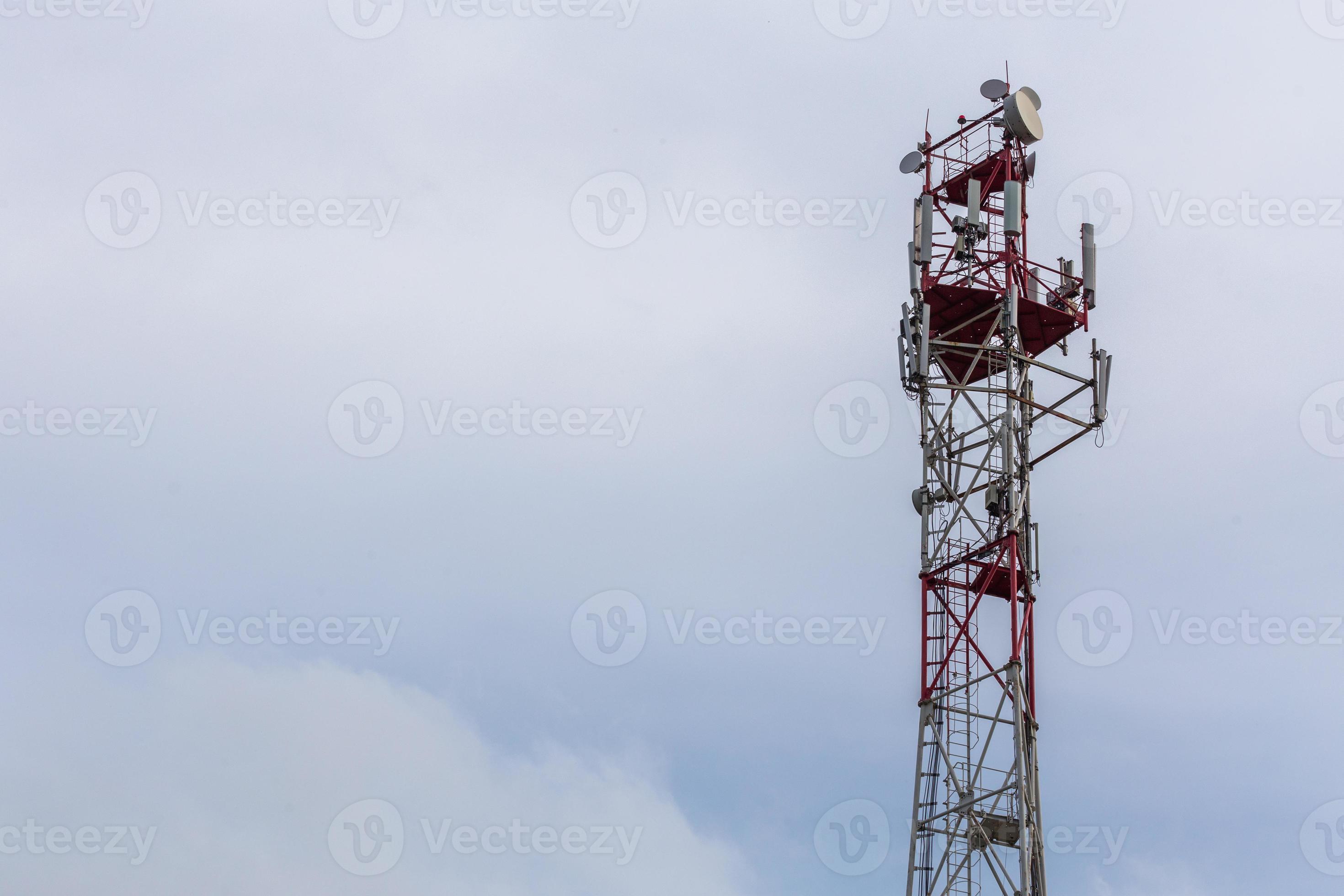 3G, 4G, 5G, wireless and cell phone telecommunication tower close-up on cloudy daylight sky ...