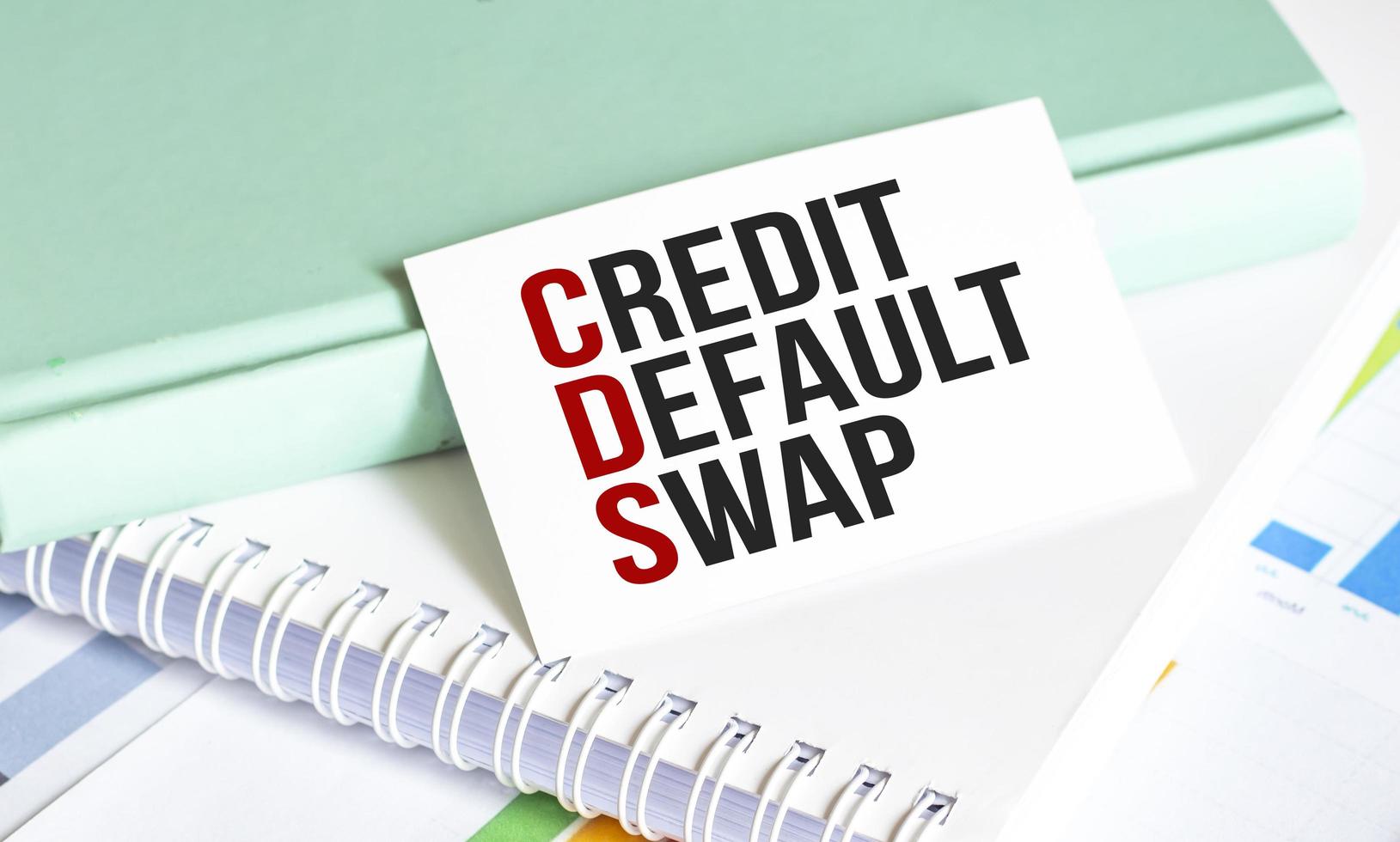 CDS Credit Default Swap Word On White Sticker And Charts 12657450 cds-credit-default-swap-word-on-white-sticker-and-charts-12657450