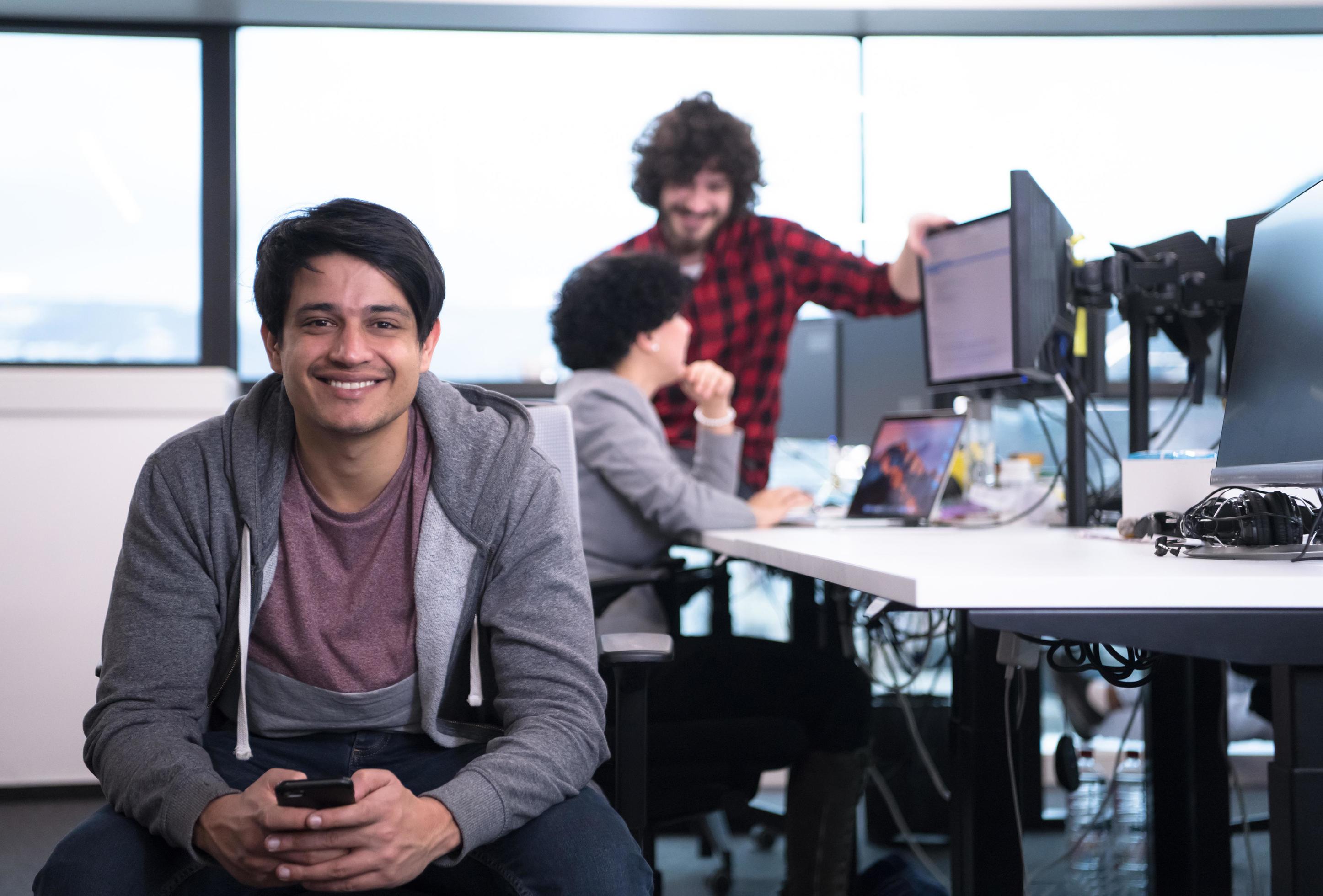 software developer using mobile phone 12708792 Stock Photo at Vecteezy