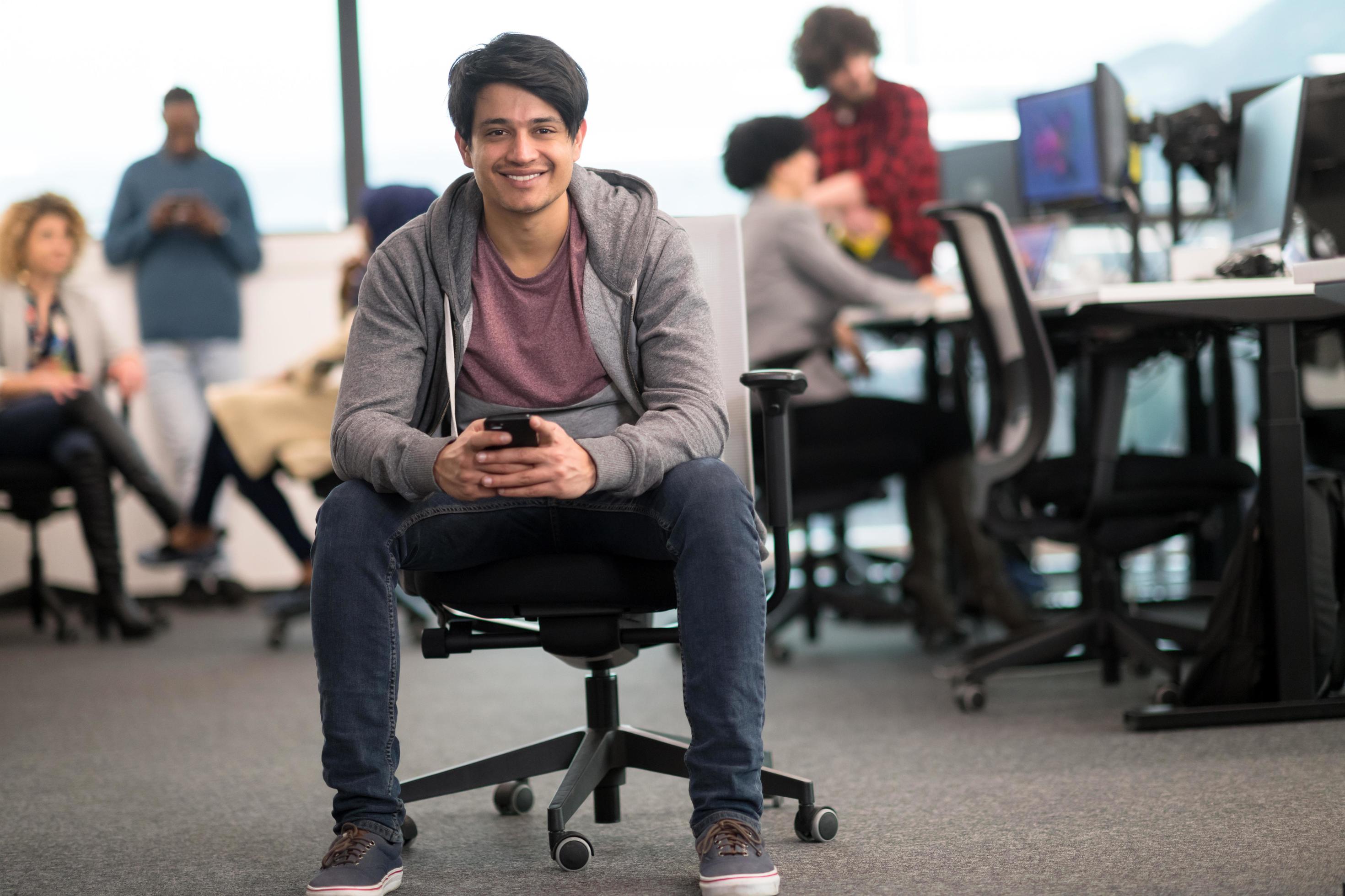 software developer using mobile phone 12728572 Stock Photo at Vecteezy