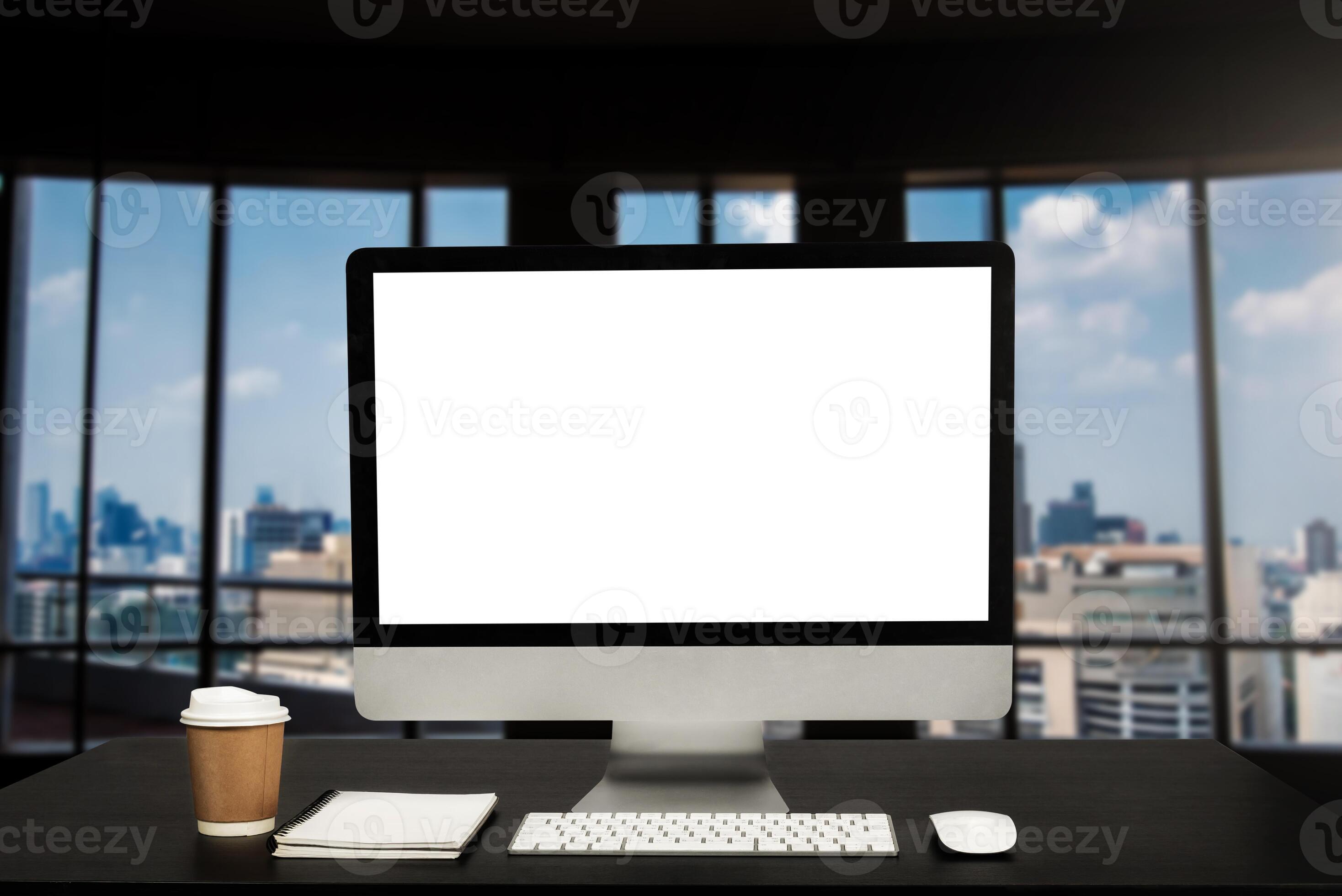 Computer monitor with white blank screen putting on white working desk with wireless mouse and ...