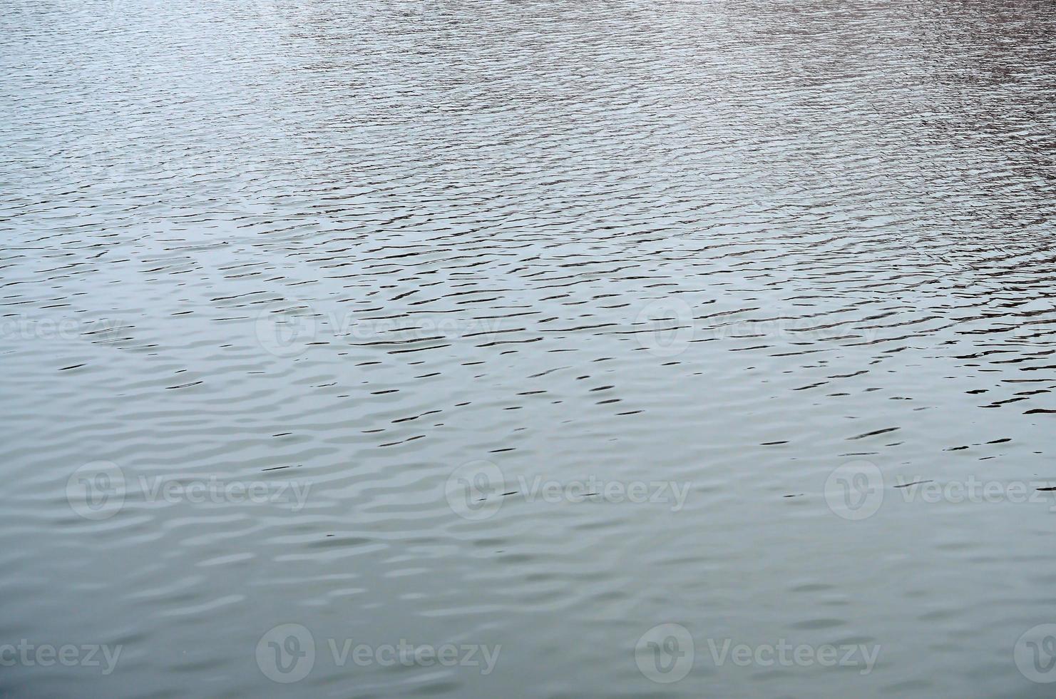 The texture of the water in the river under the influence of wind. A ...