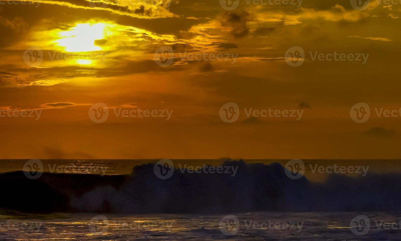 Colorful golden sunset big wave and beach Puerto Escondido Mexico ...