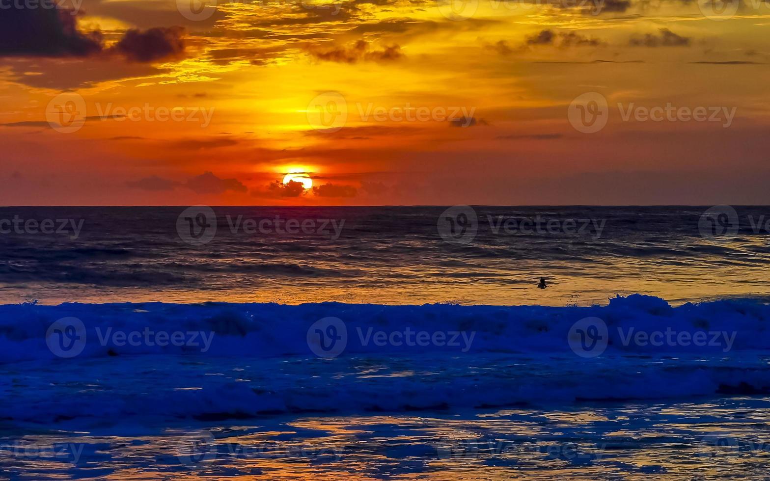 Colorful golden sunset big wave and beach Puerto Escondido Mexico ...