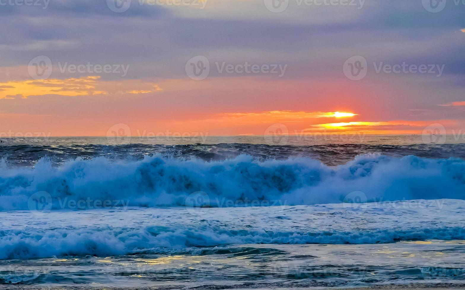 Colorful golden sunset big wave and beach Puerto Escondido Mexico ...