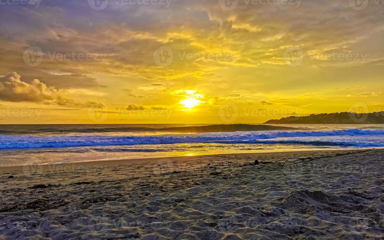 Colorful golden sunset big wave and beach Puerto Escondido Mexico ...