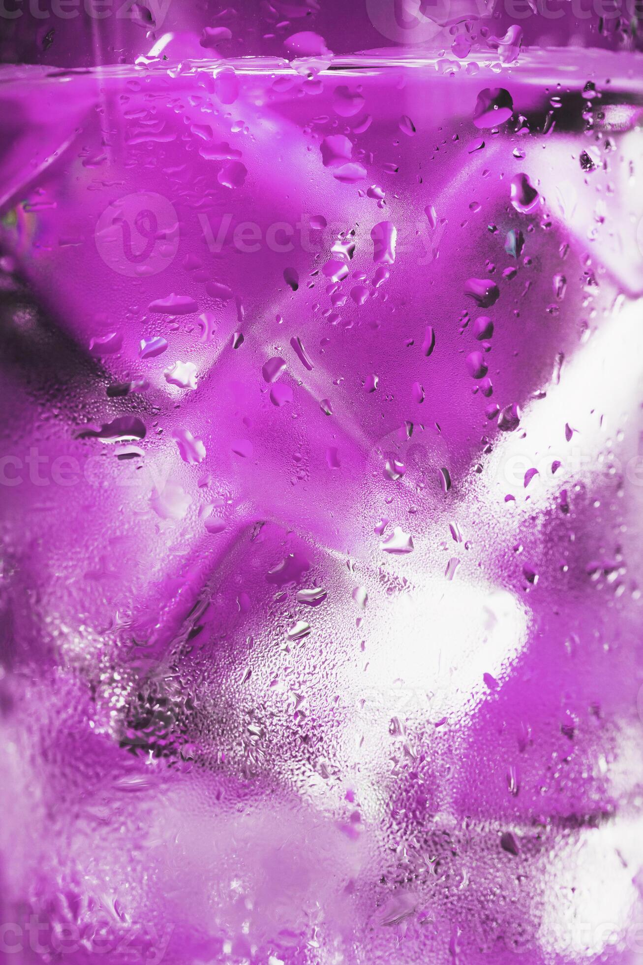 Ice cubes in a misted glass with drops of ice water close-up macro. Soft Selective Focus ...