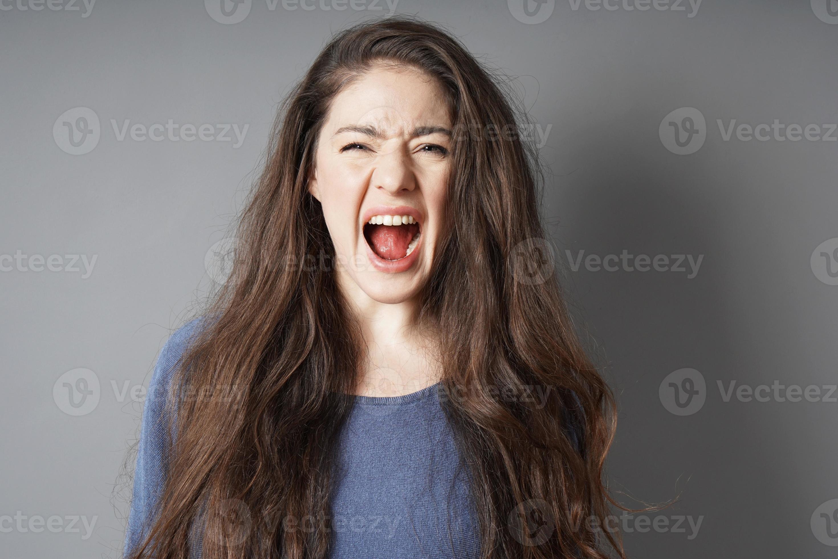 angry young woman screaming and shouting 12830686 Stock Photo at Vecteezy