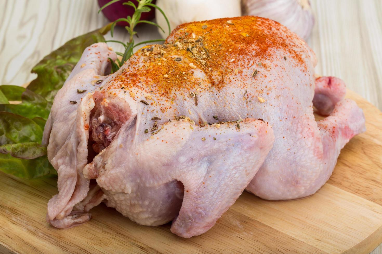 Raw chicken on wood 12845710 Stock Photo at Vecteezy