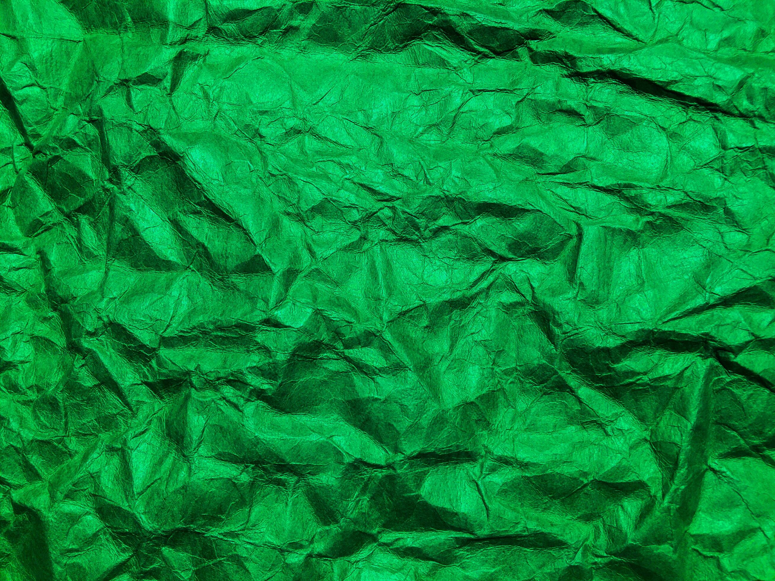 Closeup view of green crumpled paper texture background. 12866680 Stock Photo at Vecteezy