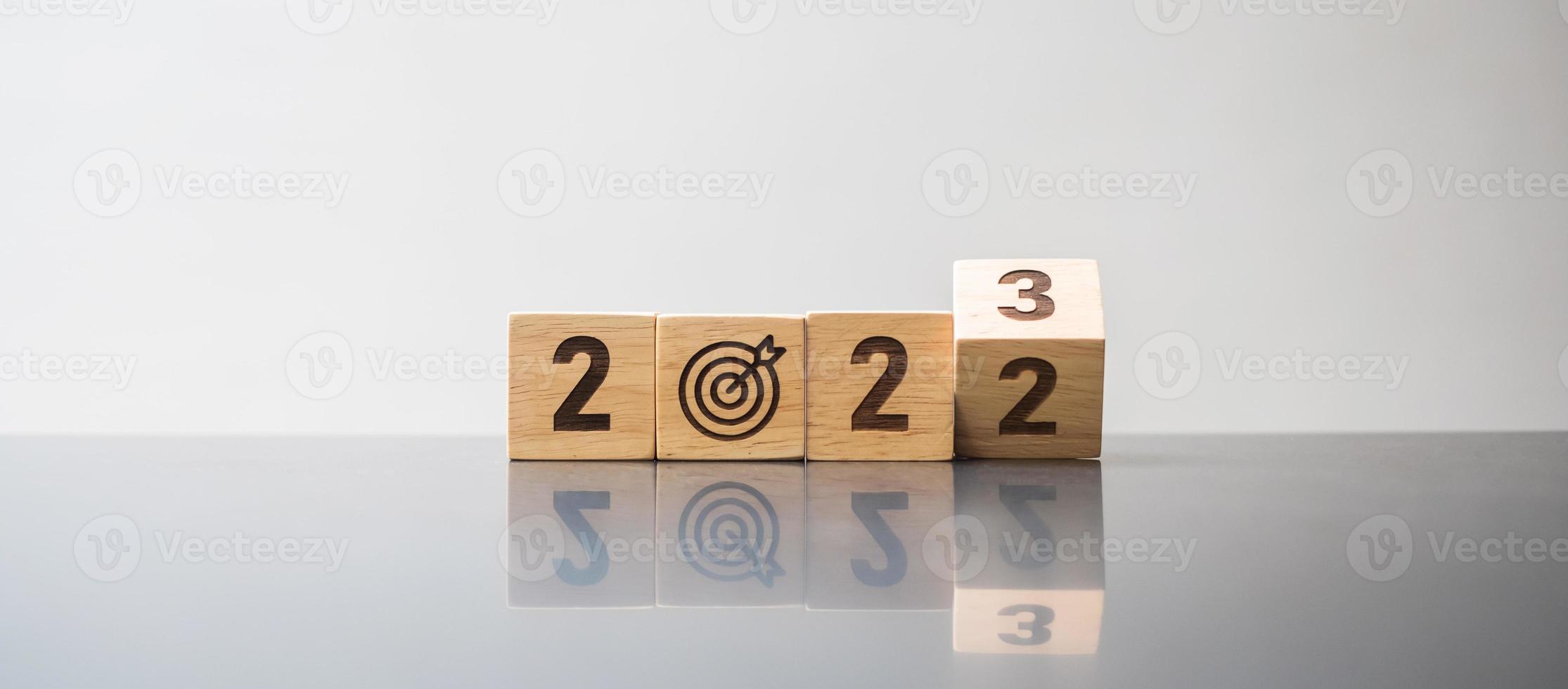 hand flip 2022 to 2023 block with dartboard sign. Business Goal, Target, Resolution, strategy ...