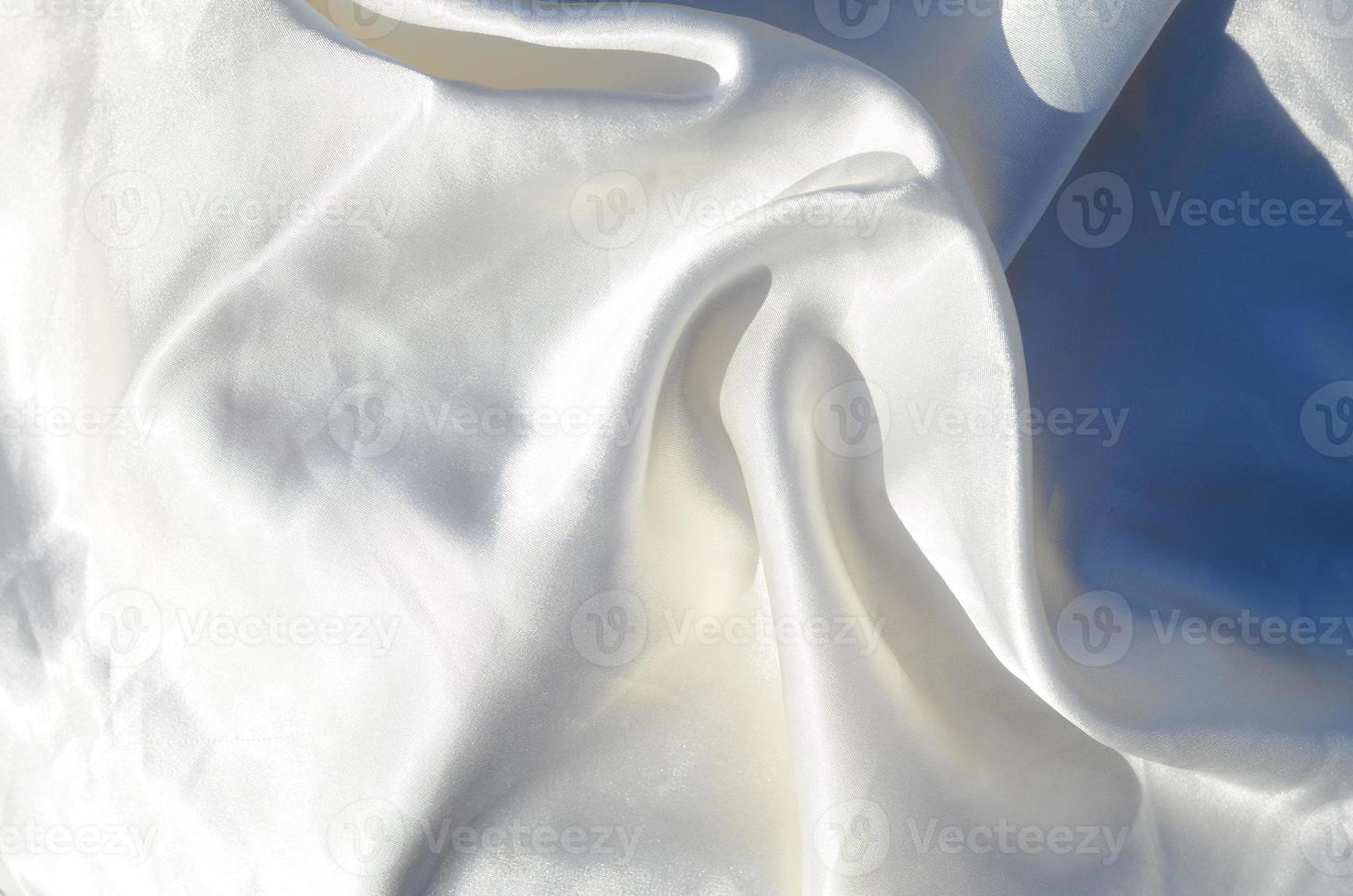 Smooth elegant white silk or satin luxury cloth texture can use as ...