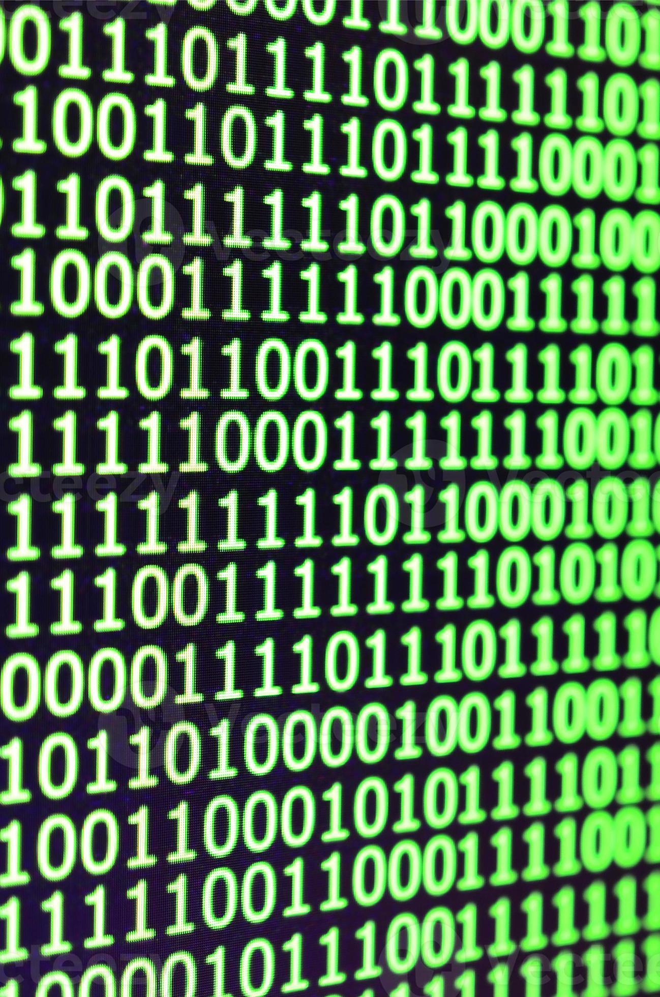 Macro Shot Of Binary Code On The Monitor Of An Office Computer The