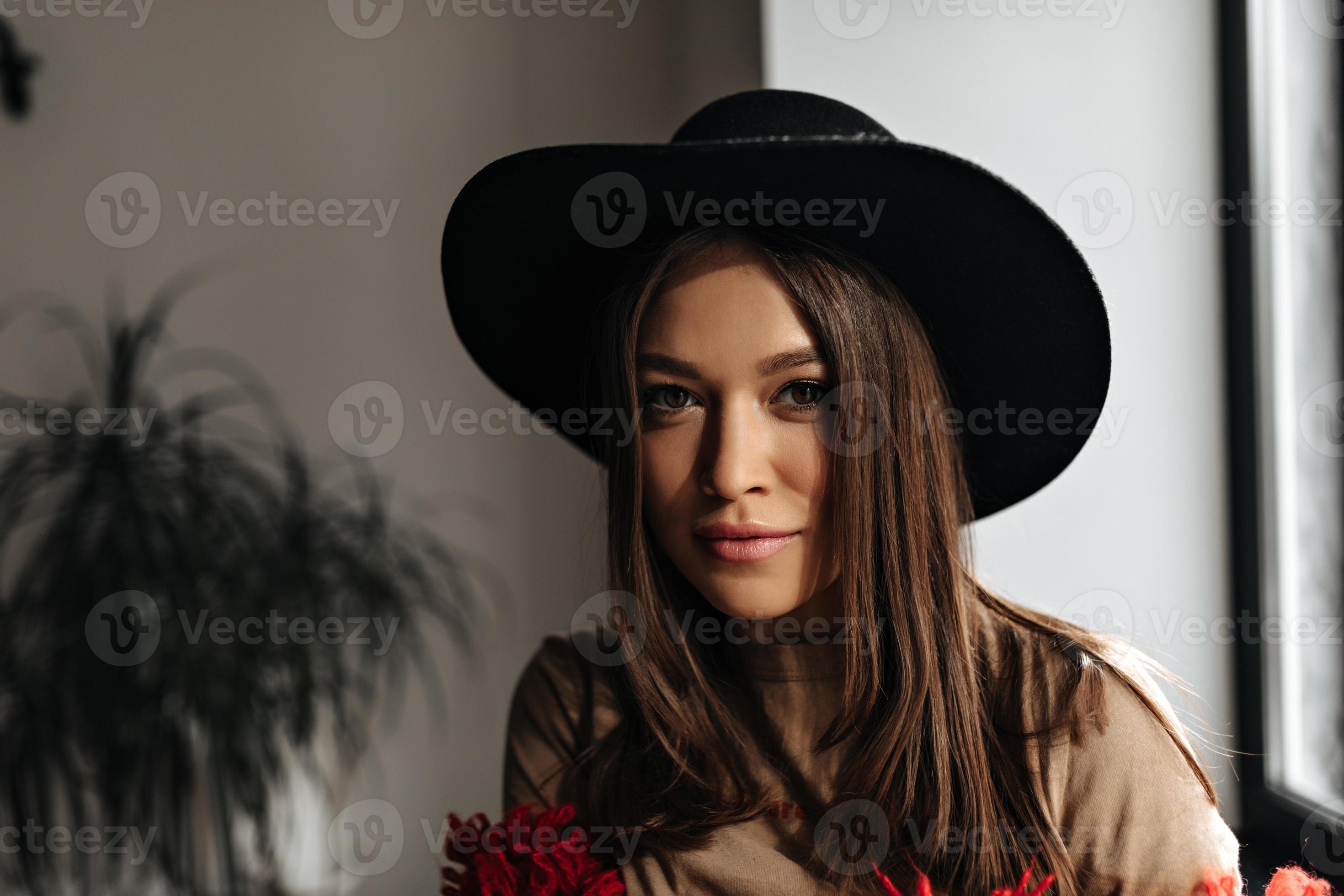 Cute Dark Haired Girl With Tanned Skin Looks Into Camera Woman In