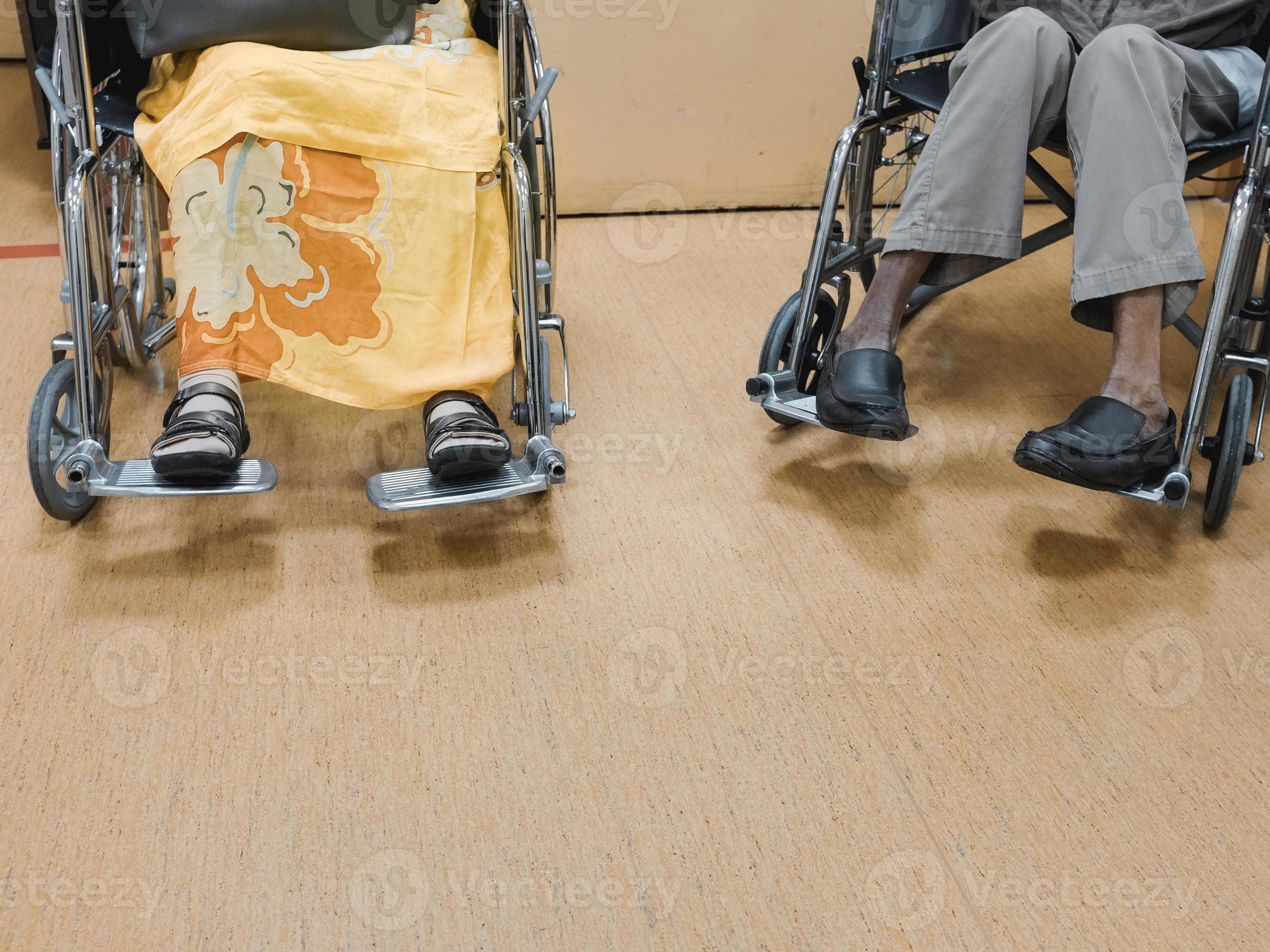 High level view of two senior citizen on wheelchairs waiting in the ... High level view of two senior citizen on wheelchairs waiting in the ...