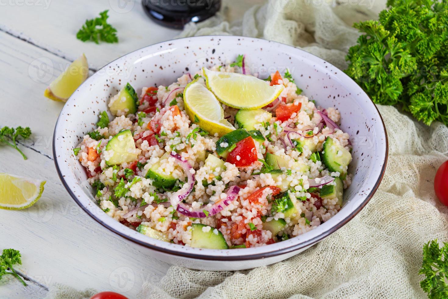 Vegetarian tabbouleh salad with couscous, parsley, cucumber, tomato ...