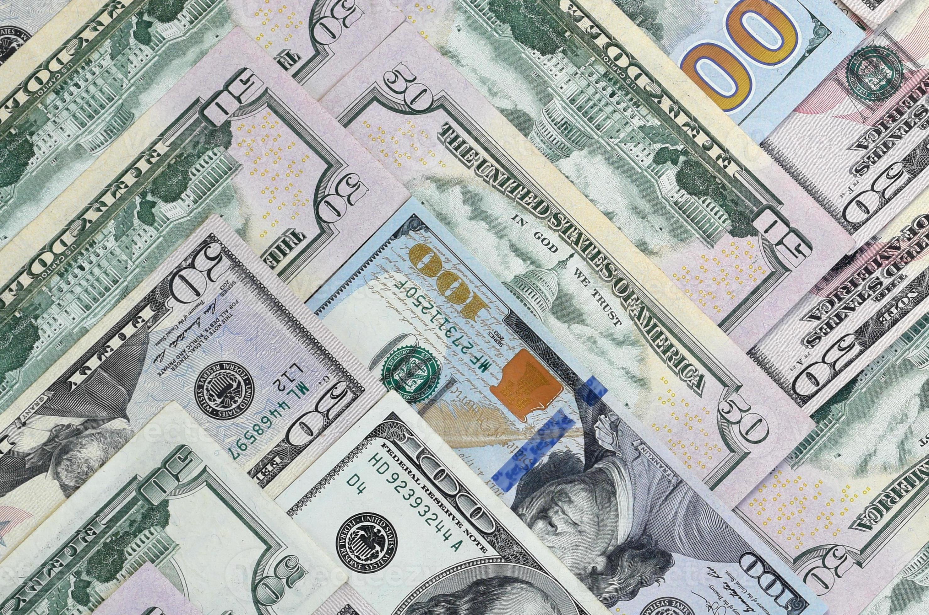 Many one hundred and fifty dollar bills on flat background surface close up. Flat lay top view ...