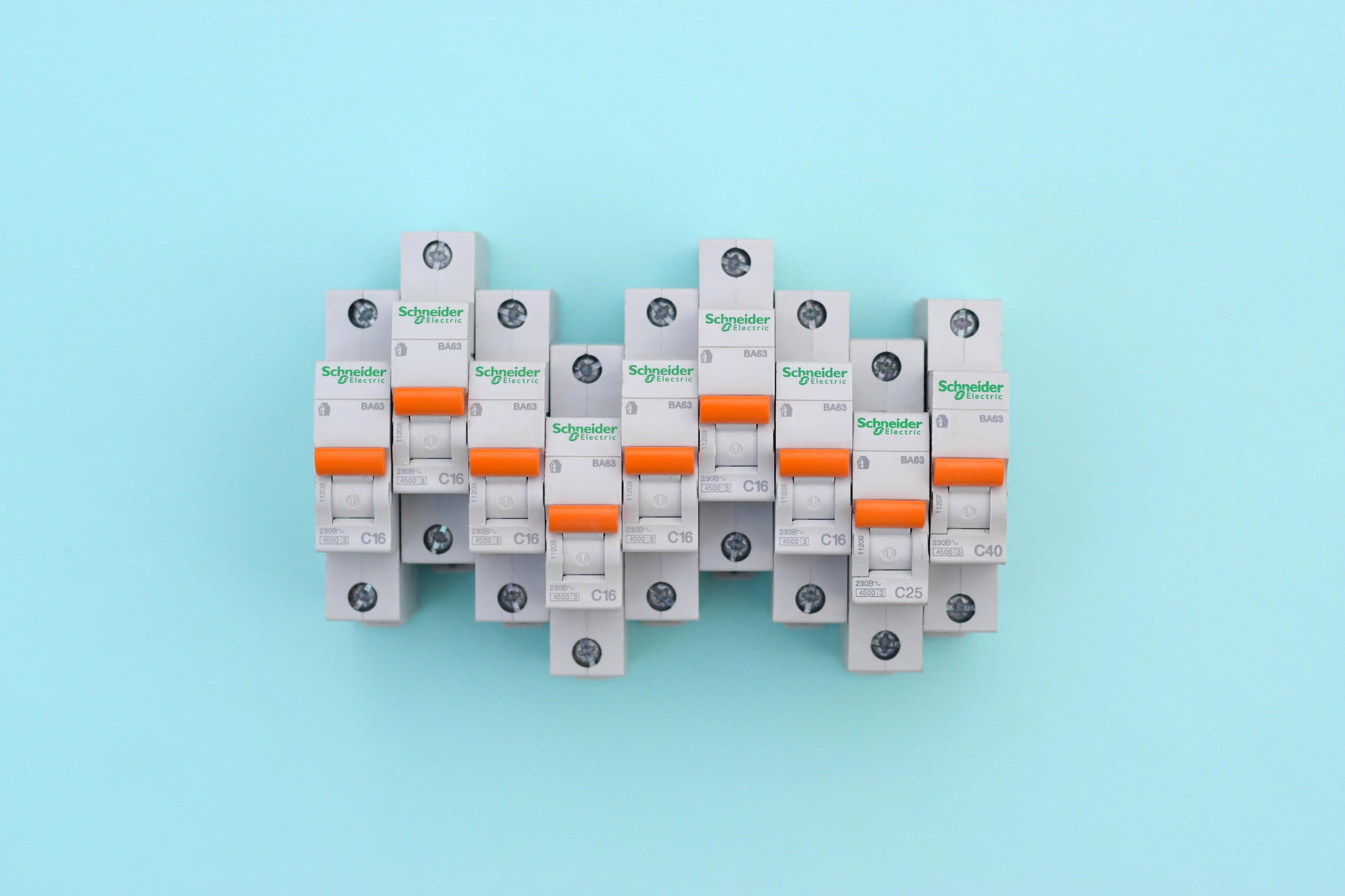 Schneider electric circuit breakers on light blue background. Schneider ... Schneider electric circuit breakers on light blue background. Schneider ...