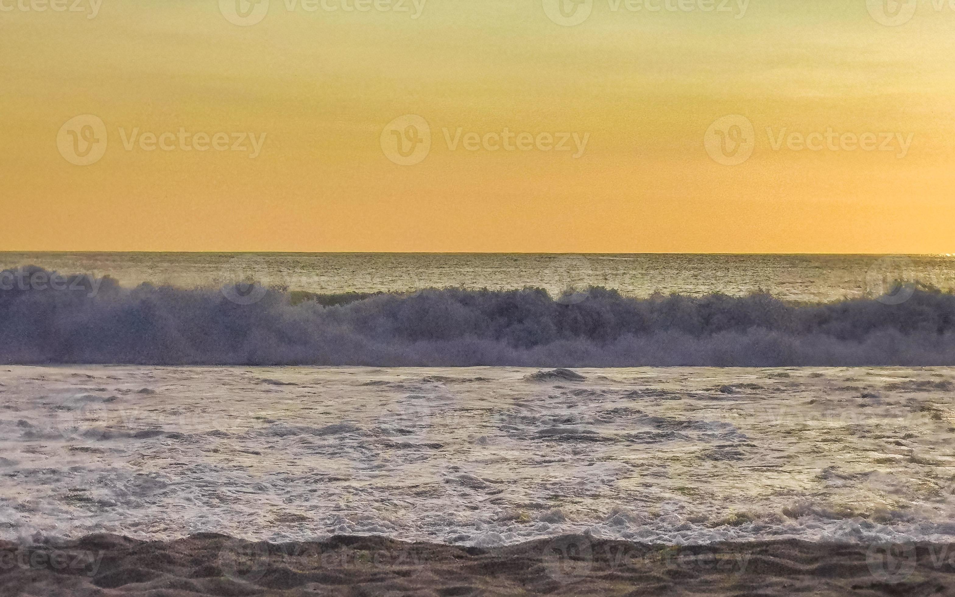 Colorful golden sunset big wave and beach Puerto Escondido Mexico ...