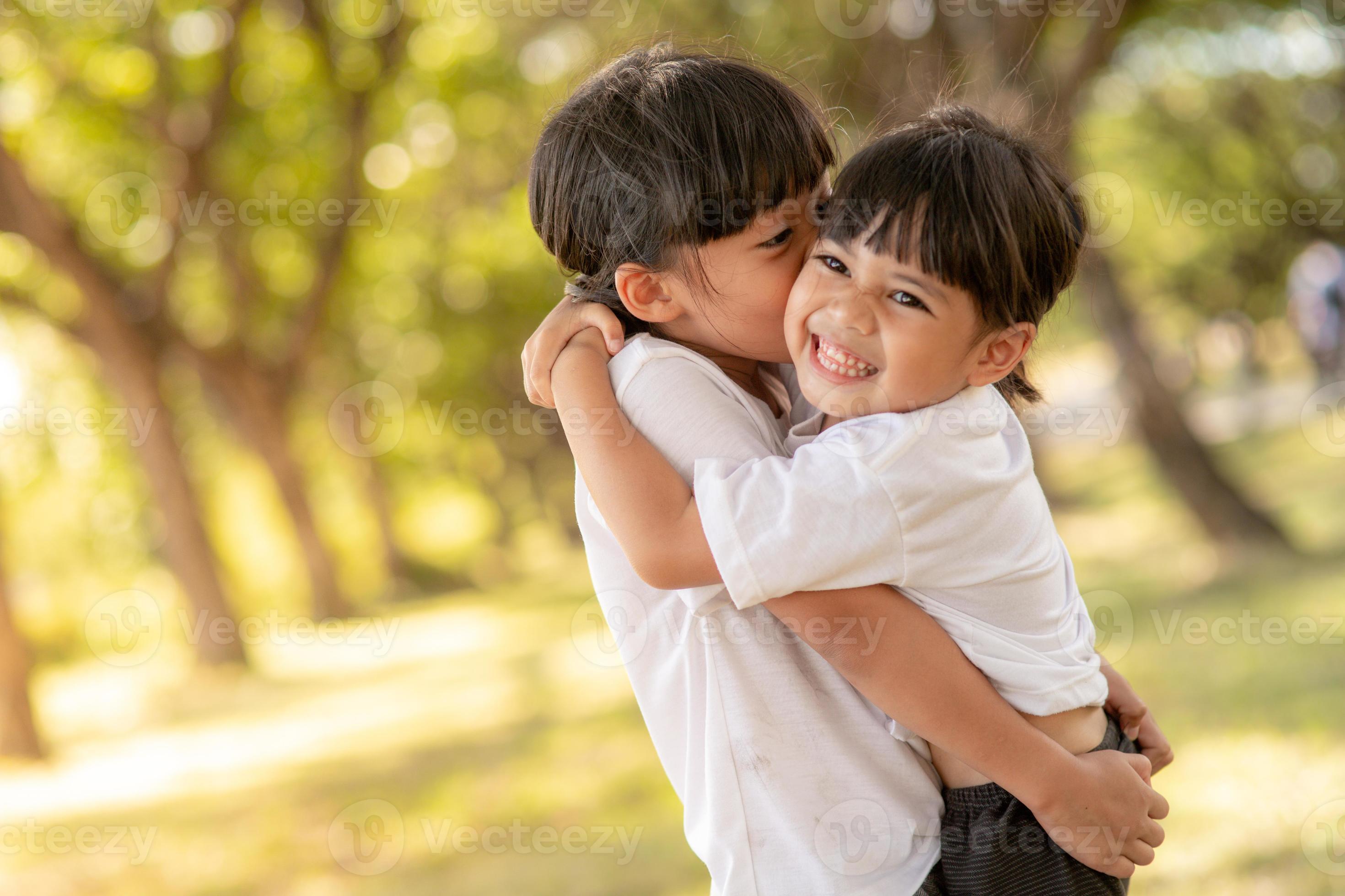 Two Asian little child girls hugging each other with love in the garden 13062101 Stock Photo at ...
