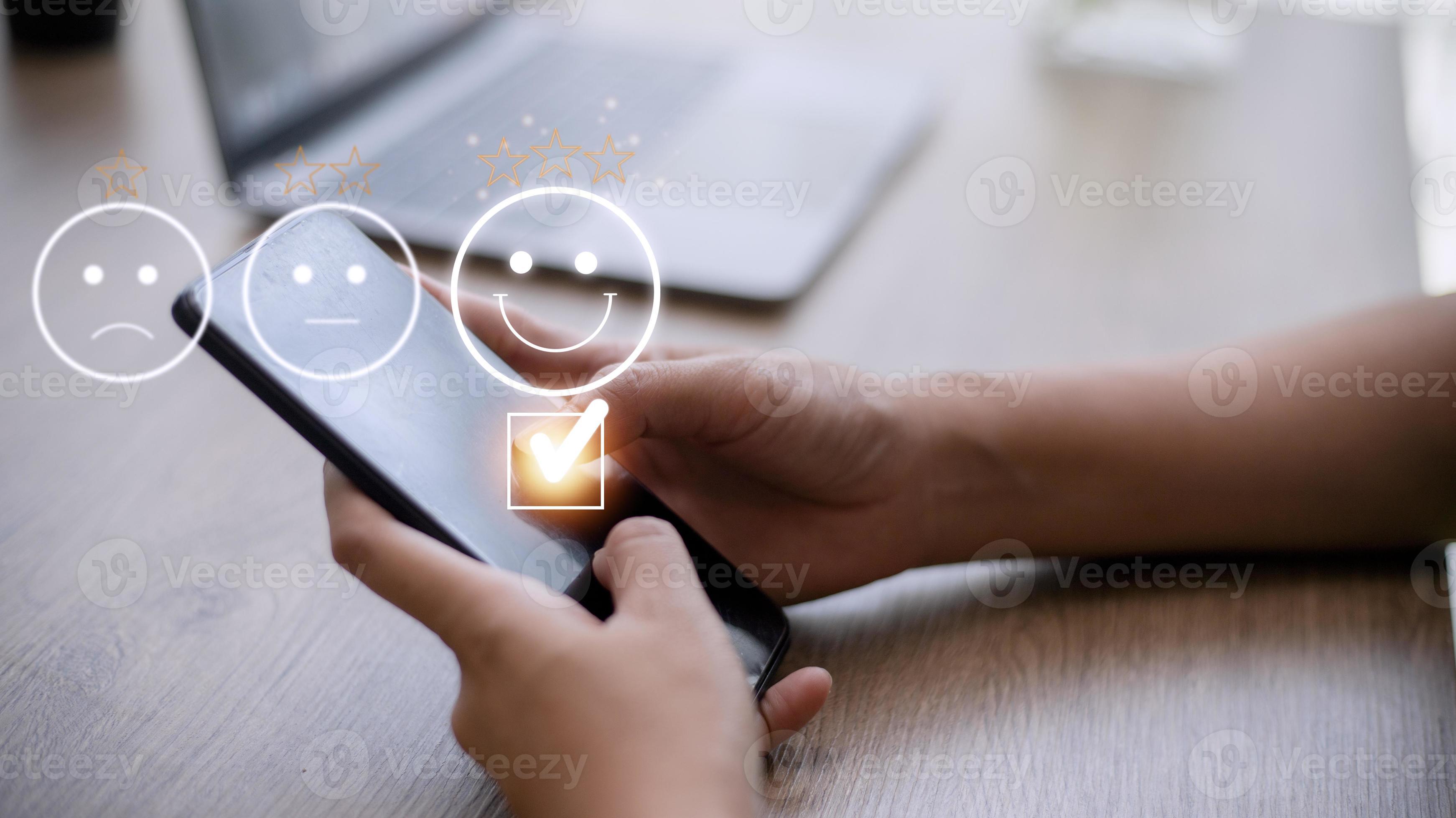 Customer service evaluation concept. using a smartphone is pressing ...