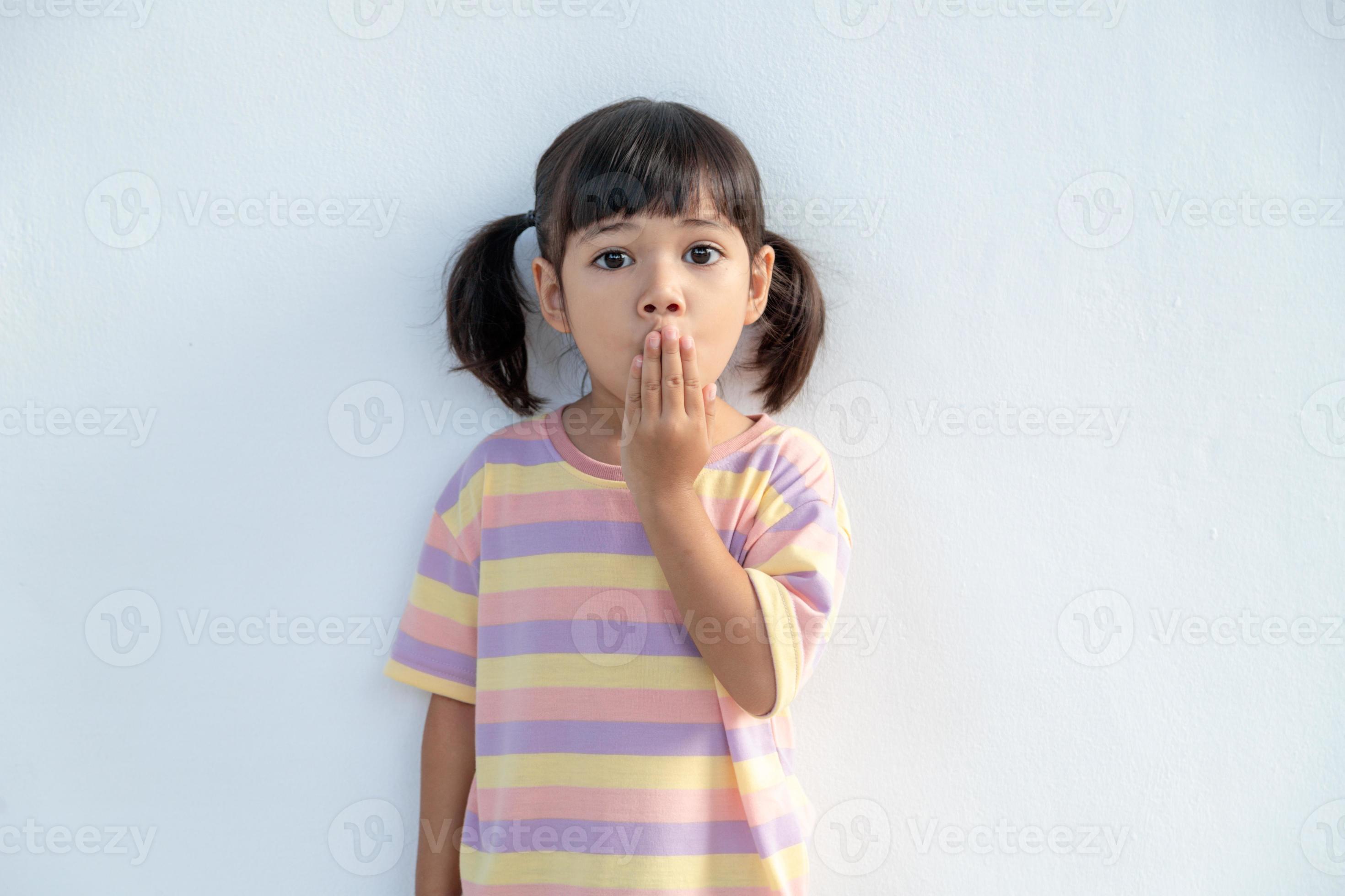 Portrait of surprised cute little toddler girl child standing isolated ...