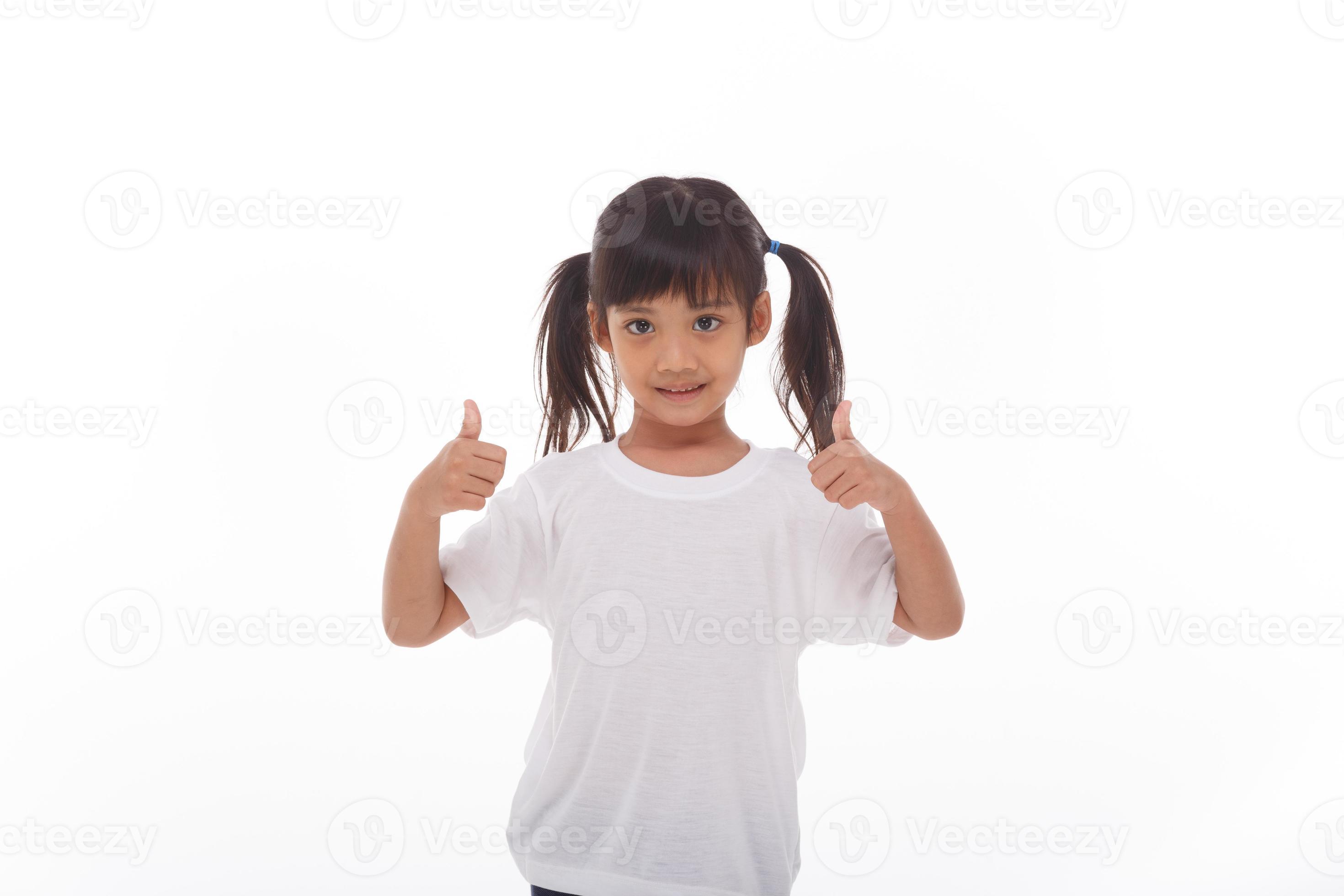 Little asian girl wearing mask for protect pm2.5 and show thumbs up gesture for good air outdoor ...