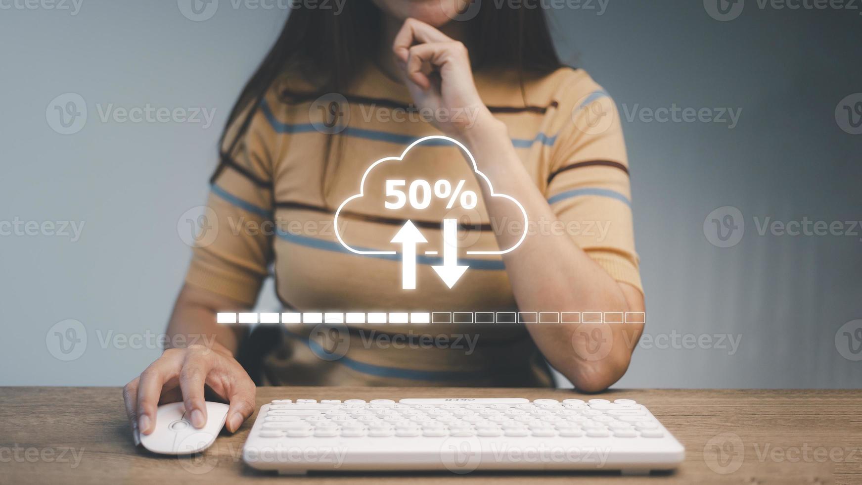 woman doing cloud uploading or downloading on laptop computer at office ... woman doing cloud uploading or downloading on laptop computer at office ...