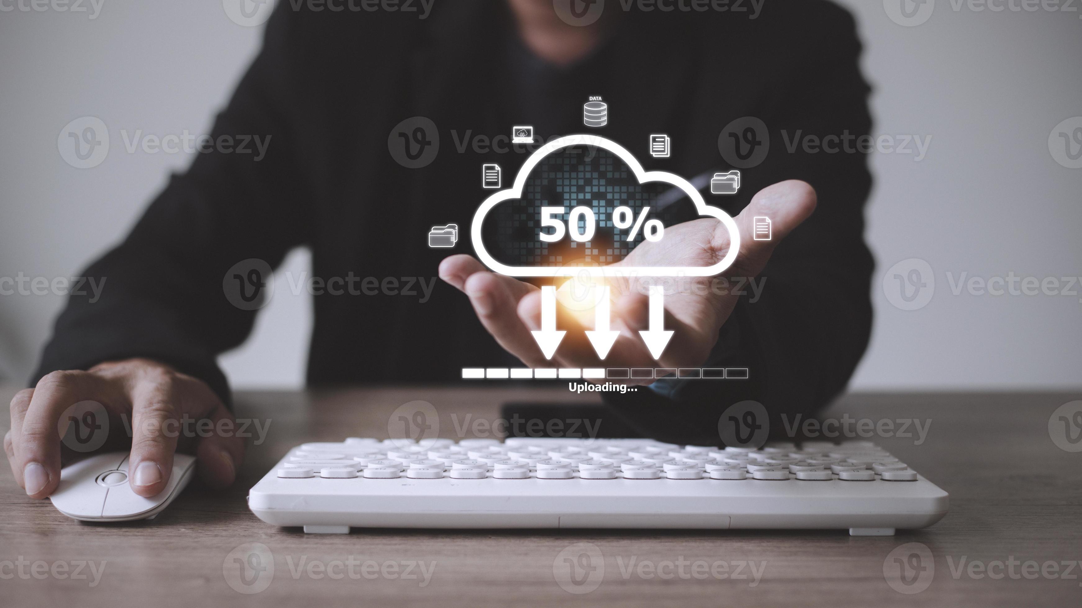 Cloud storage technology concept. Businessmen use laptops to synchronize documents or data to ...