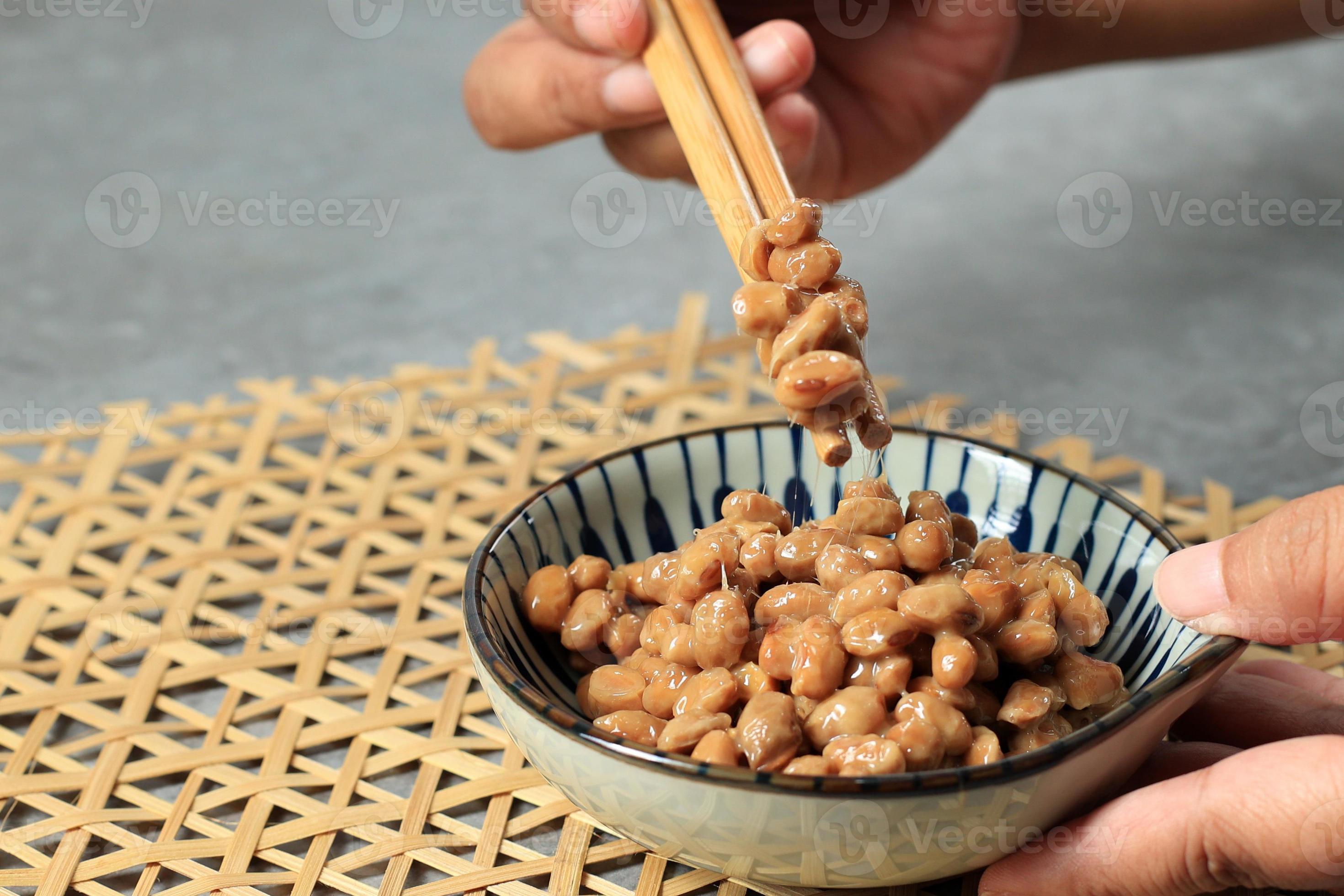 Natto in a Plate on Cement Background Lifted with Chopsticks 13082754 Stock Photo at Vecteezy