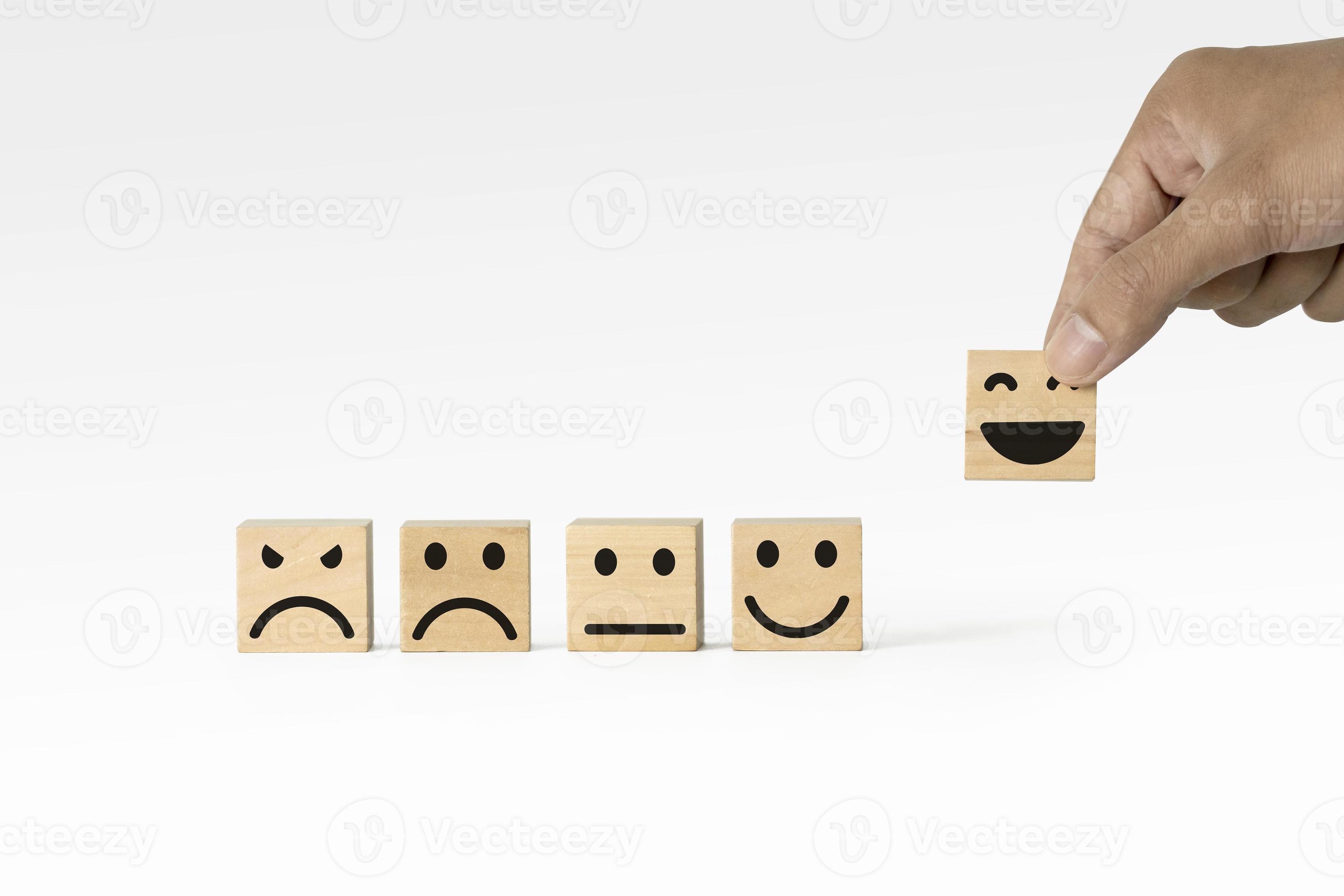 Hand holding smile face symbol on wooden cube blocks Best service ... Hand holding smile face symbol on wooden cube blocks Best service ...