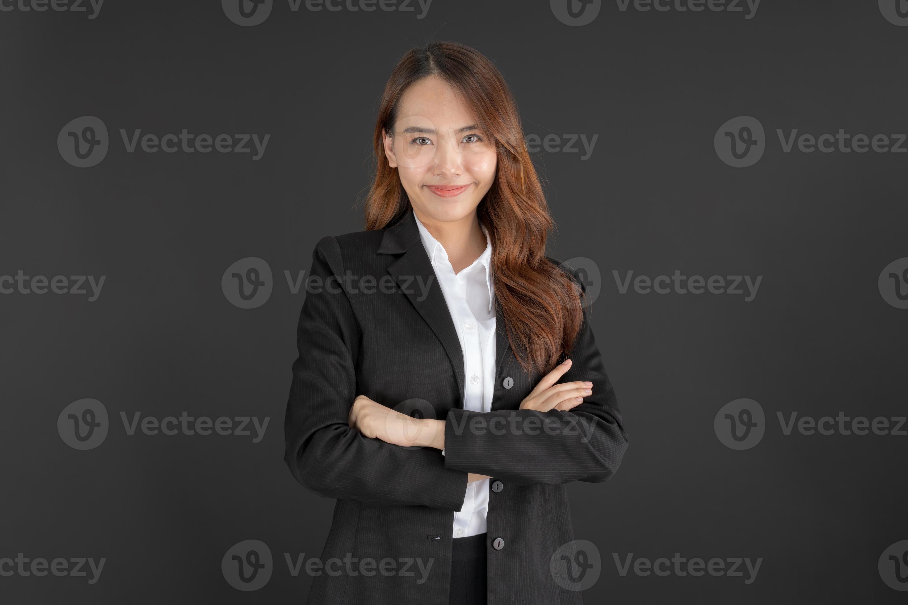Business woman wearing a black suit Standing with arms crossed ...