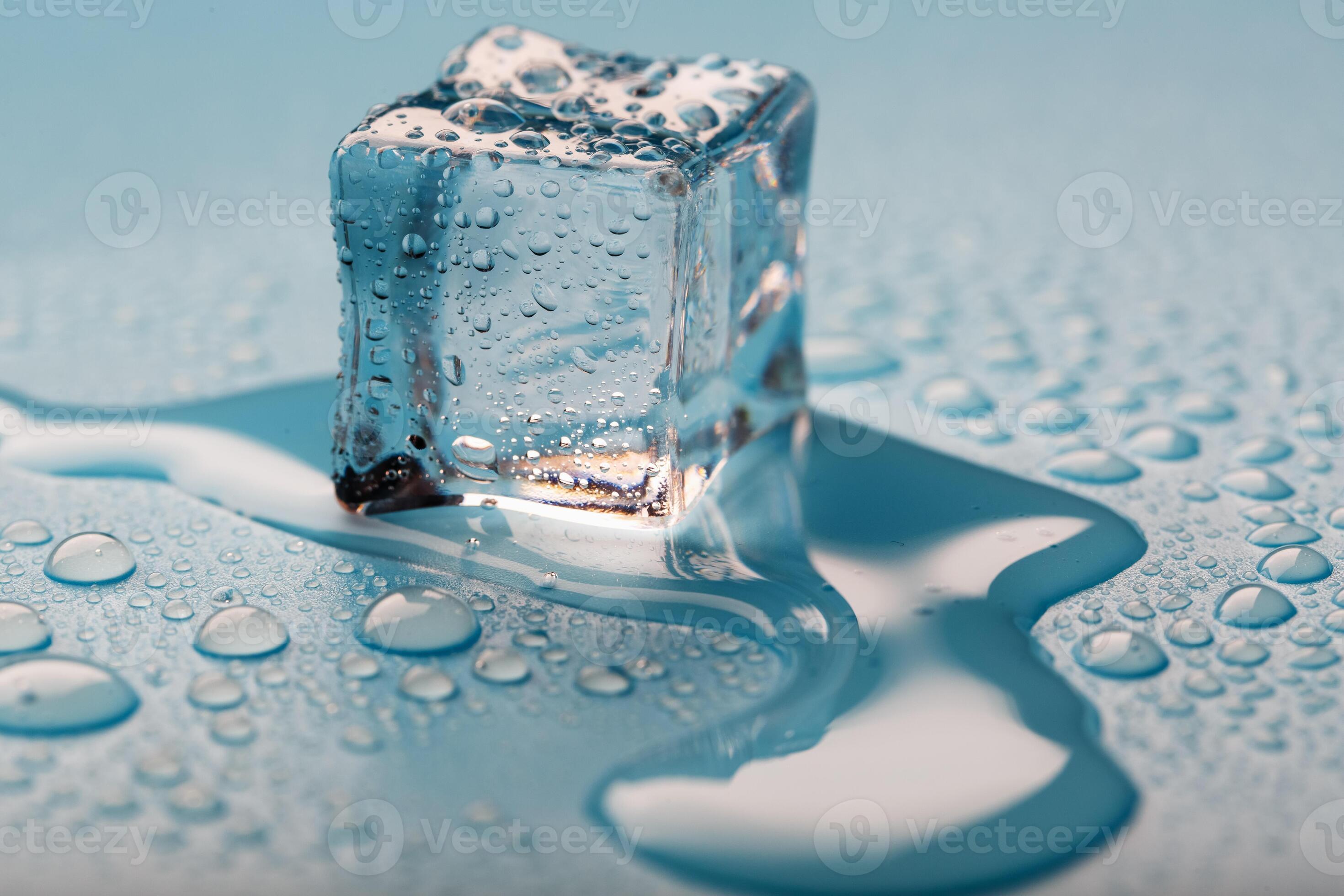 Ice cube with water drops on a blue background. The ice is melting. 13151363 Stock Photo at Vecteezy