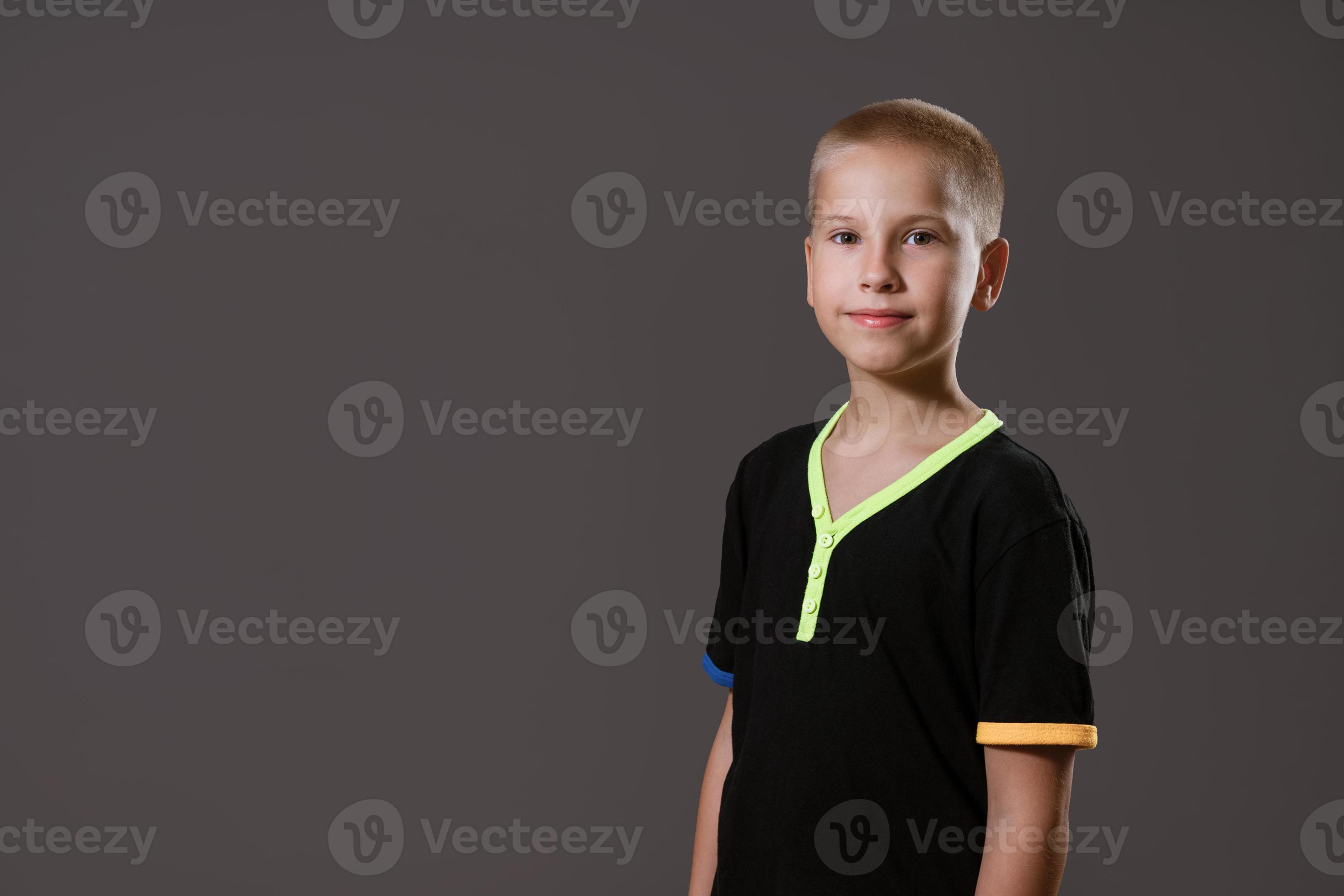 Portrait of young guy in black T-shirt on gray background 13151966 ...