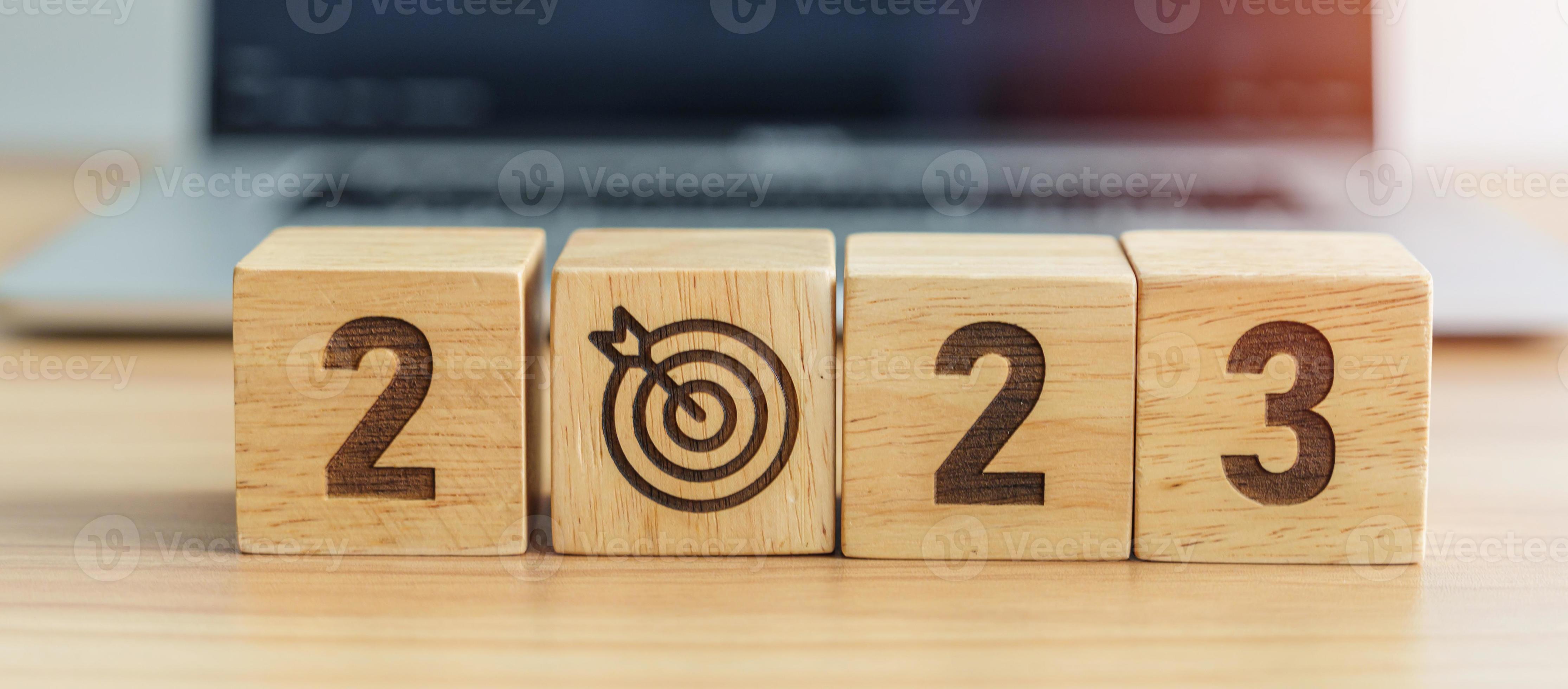 2023 Year block with dartboard icon against computer laptop background. Goal, Target, Resolution ...
