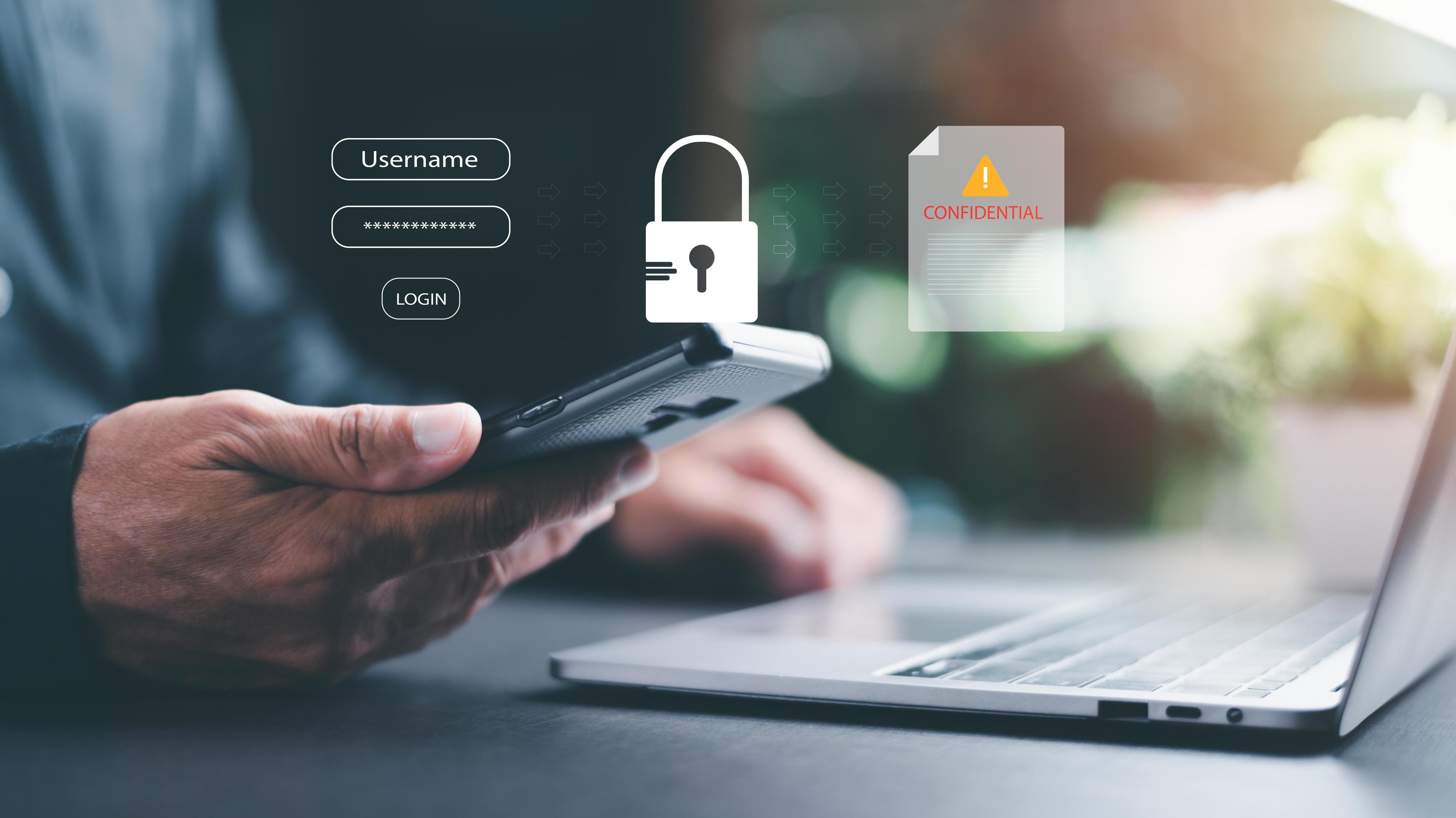 Businessman holding smartphone in hand to enter system, confidential document protection concept ...
