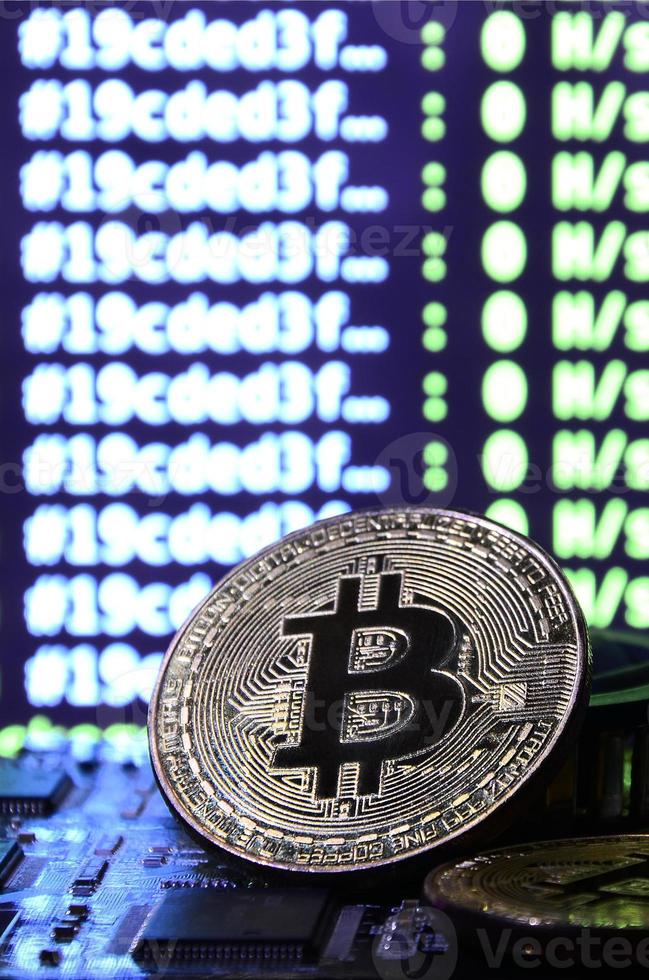 The digital process of cryptocurrency mining by using the GPUs. Bitcoins and video card on a ...