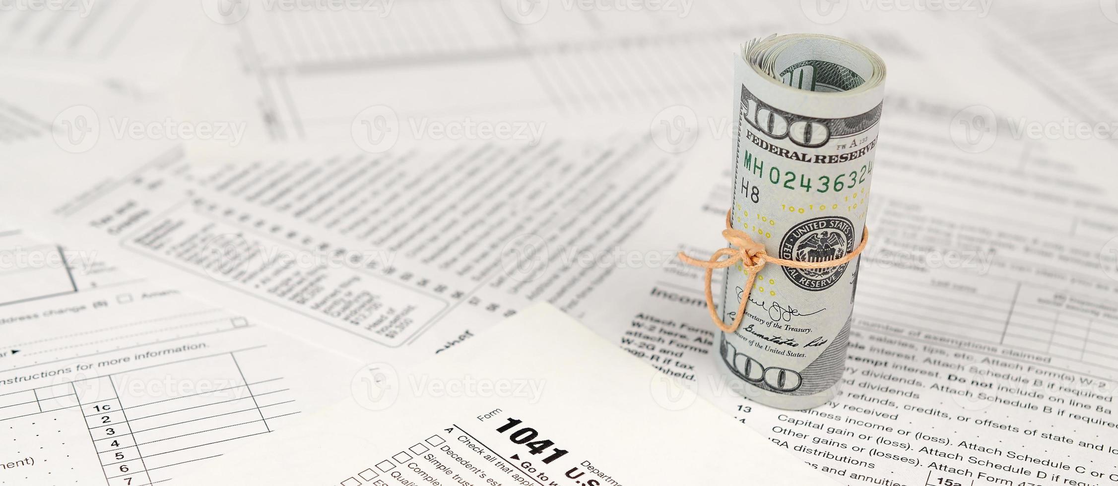 1041 U.S. Income tax return for Estates and Trusts form with roll of ... 1041 U.S. Income tax return for Estates and Trusts form with roll of ...