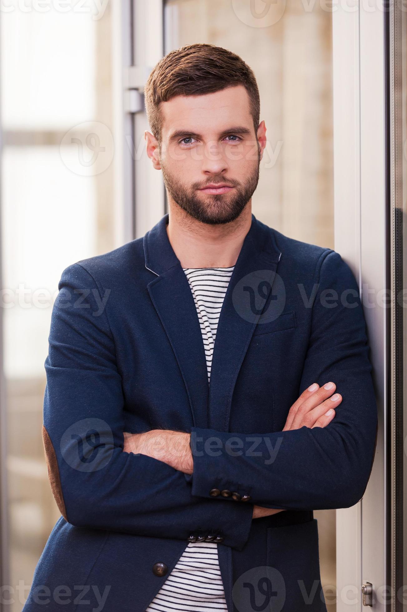 Confident Handsome Confident Young Man In Smart Casual Wear Keeping Arms Crossed And Looking At