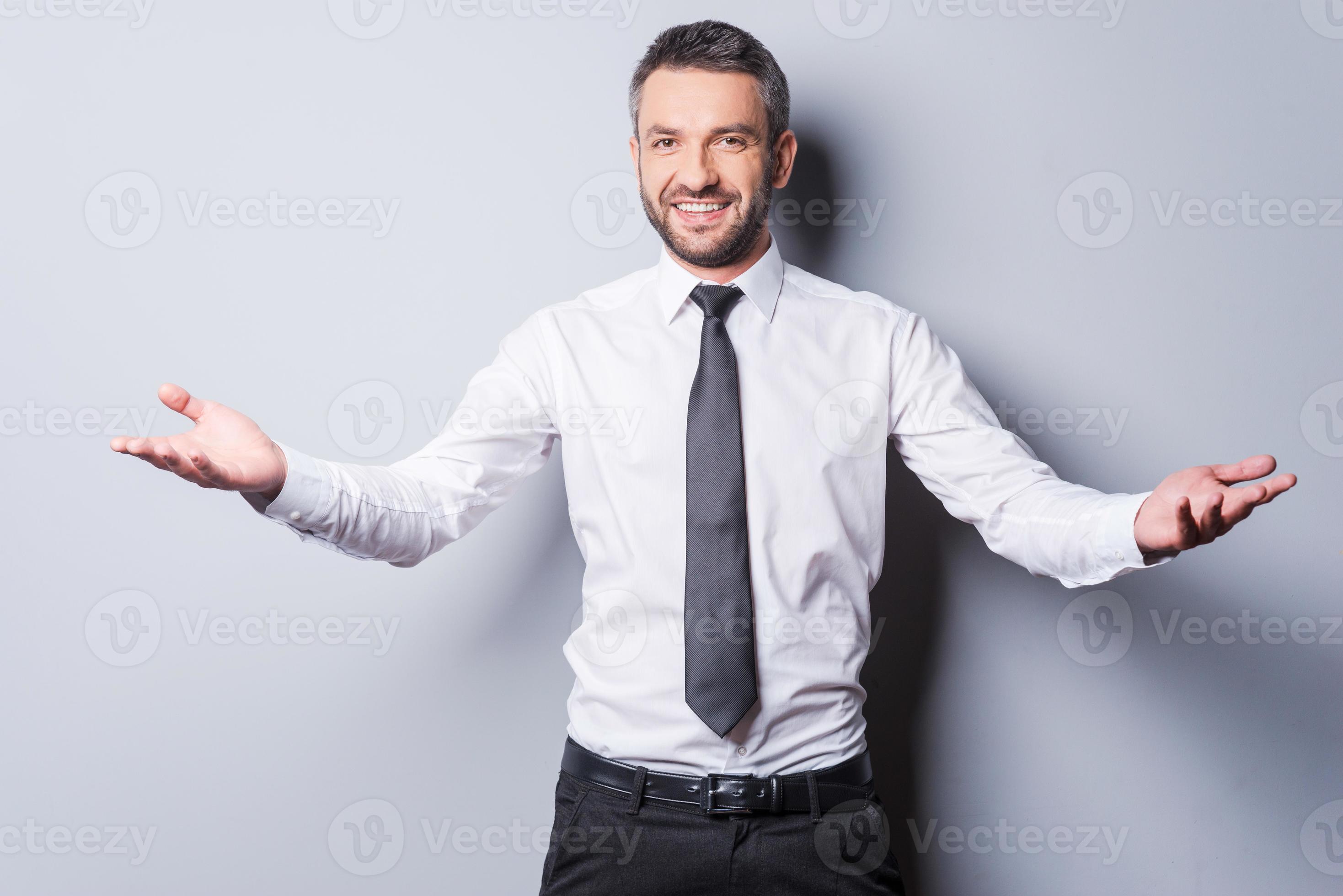 You are welcome Cheerful mature man in shirt and tie gesturing welcome ... You are welcome Cheerful mature man in shirt and tie gesturing welcome ...