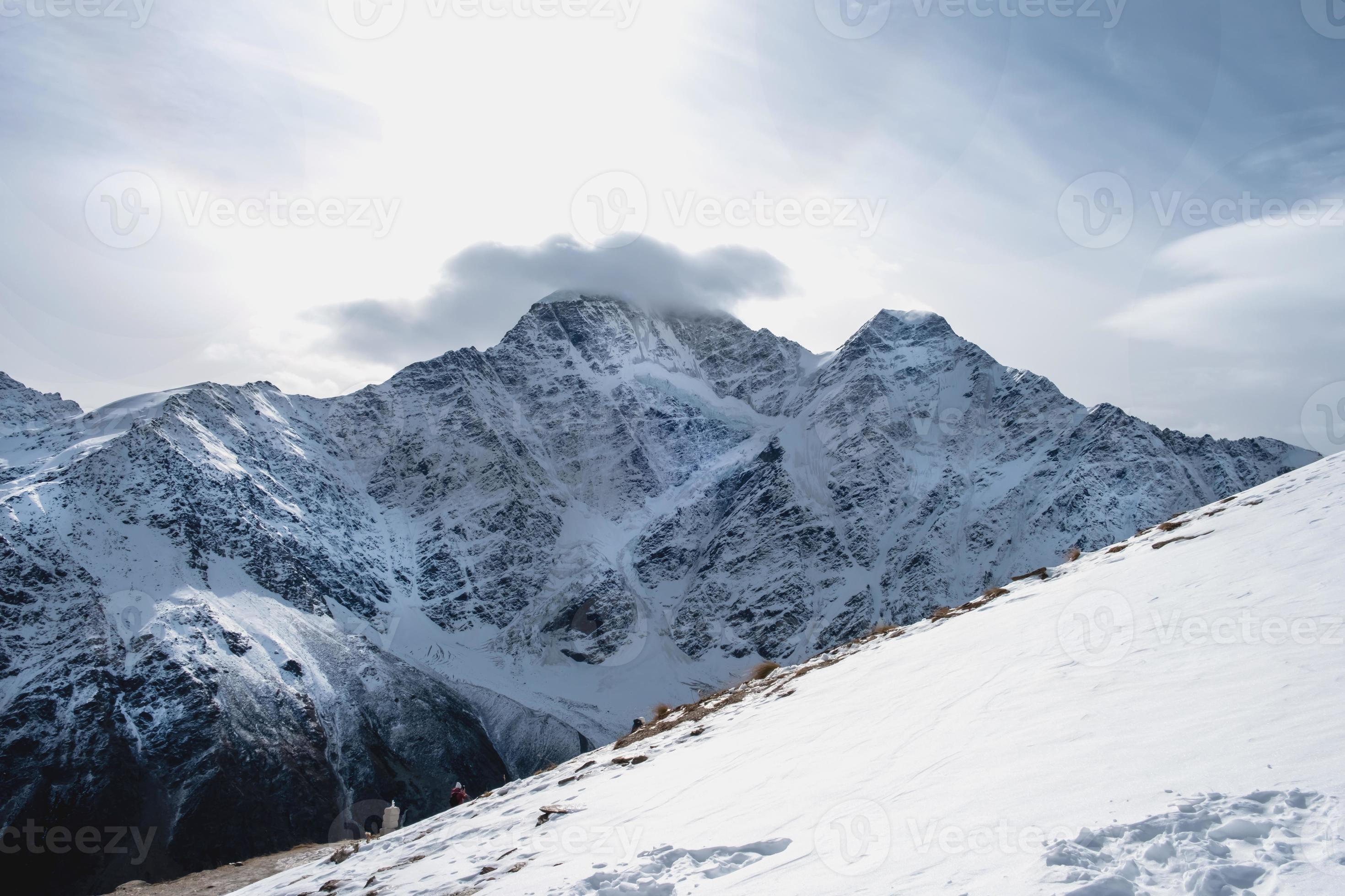 View of the mountain range, steep slopes and snow-capped rocky peaks ...