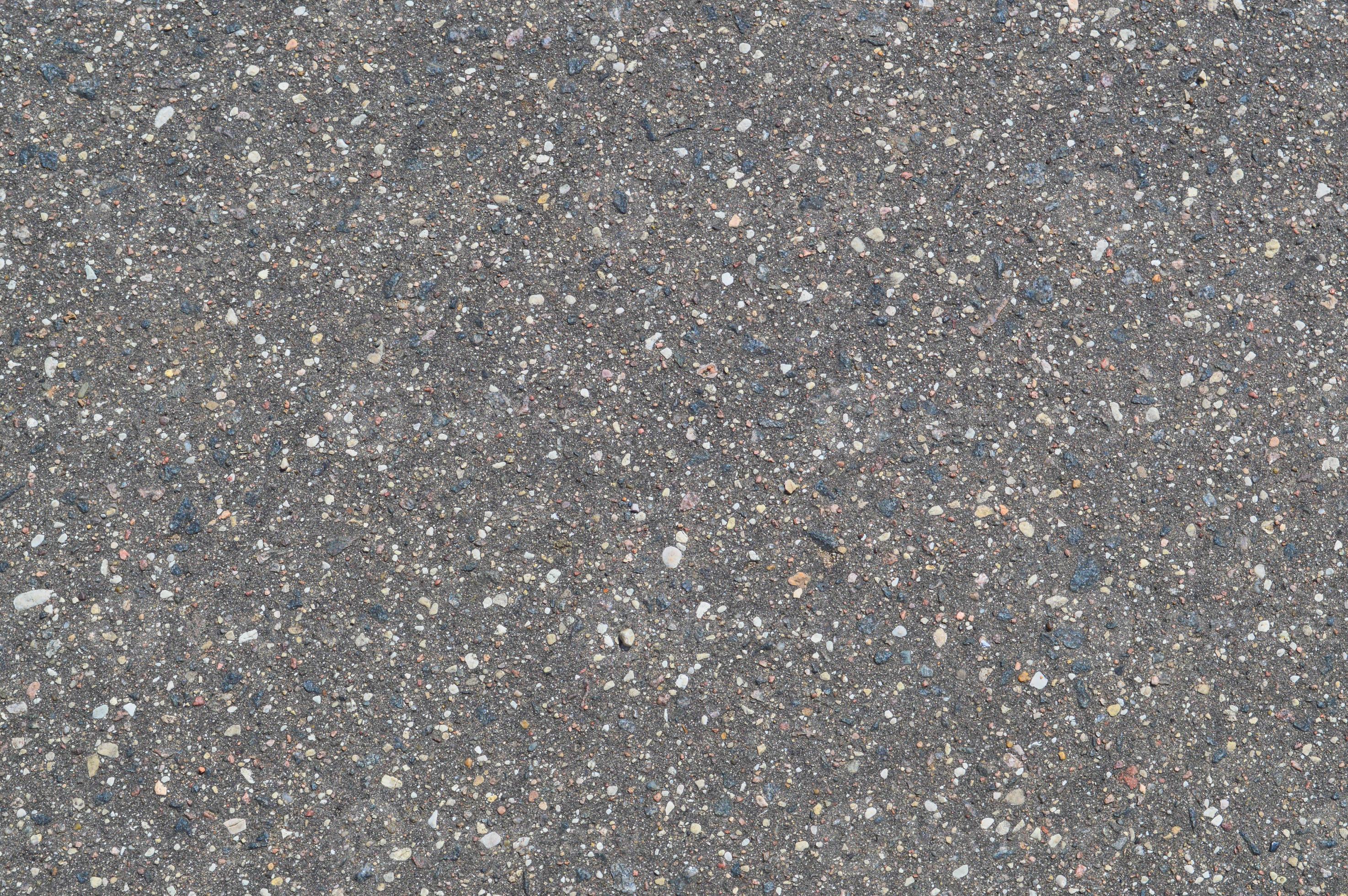 The Texture Of The Background Of Stone Black Gray Asphalt Road With
