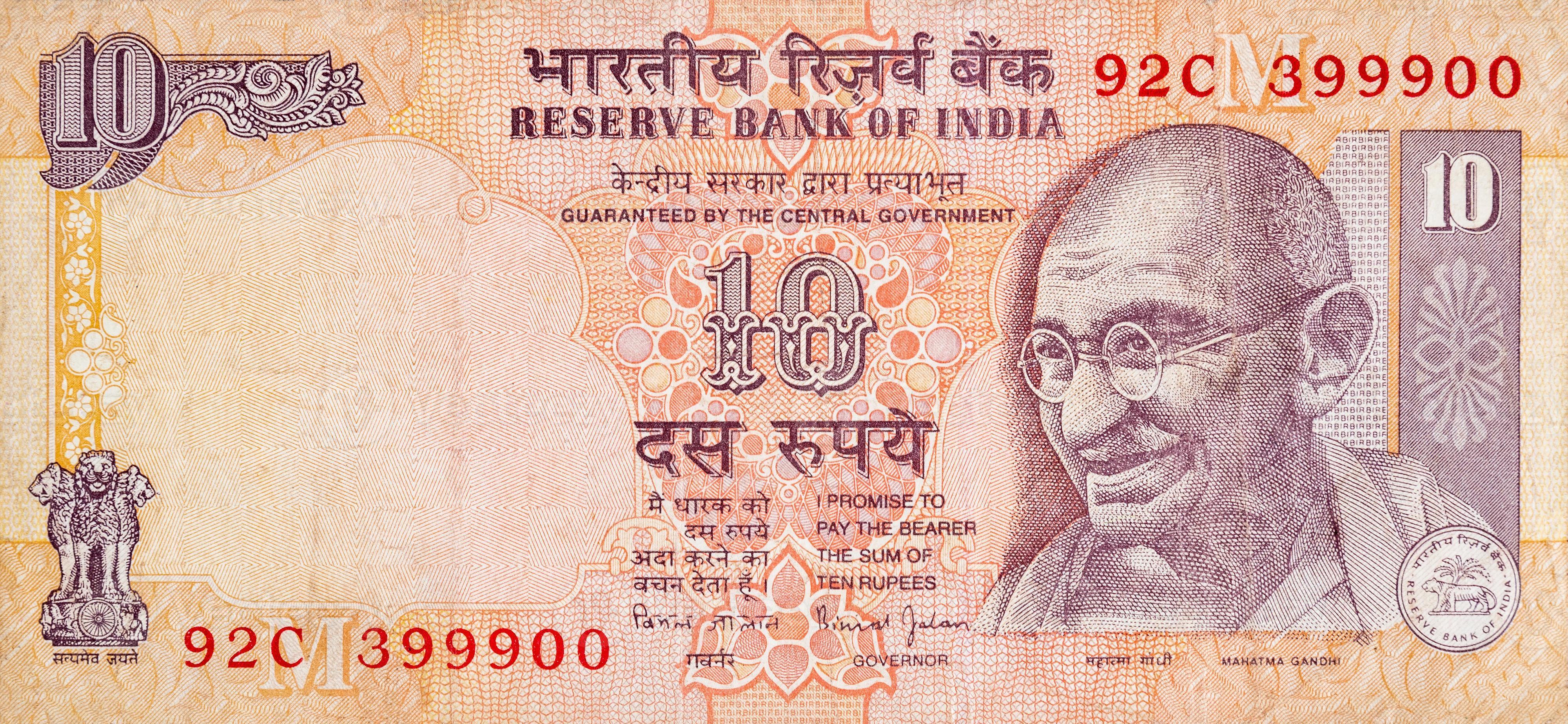 Mahatma Gandhi face on Indian bank note ten rupees. 10 Rupee National currency of India 13423686 ...