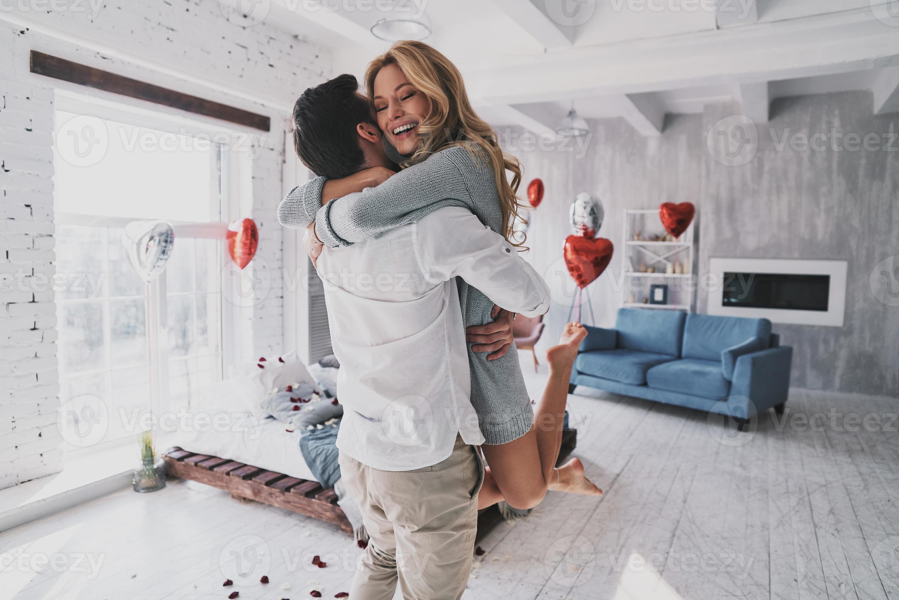 Moments Of Intimacy Beautiful Young Couple Embracing And Smiling While Spending Time In The