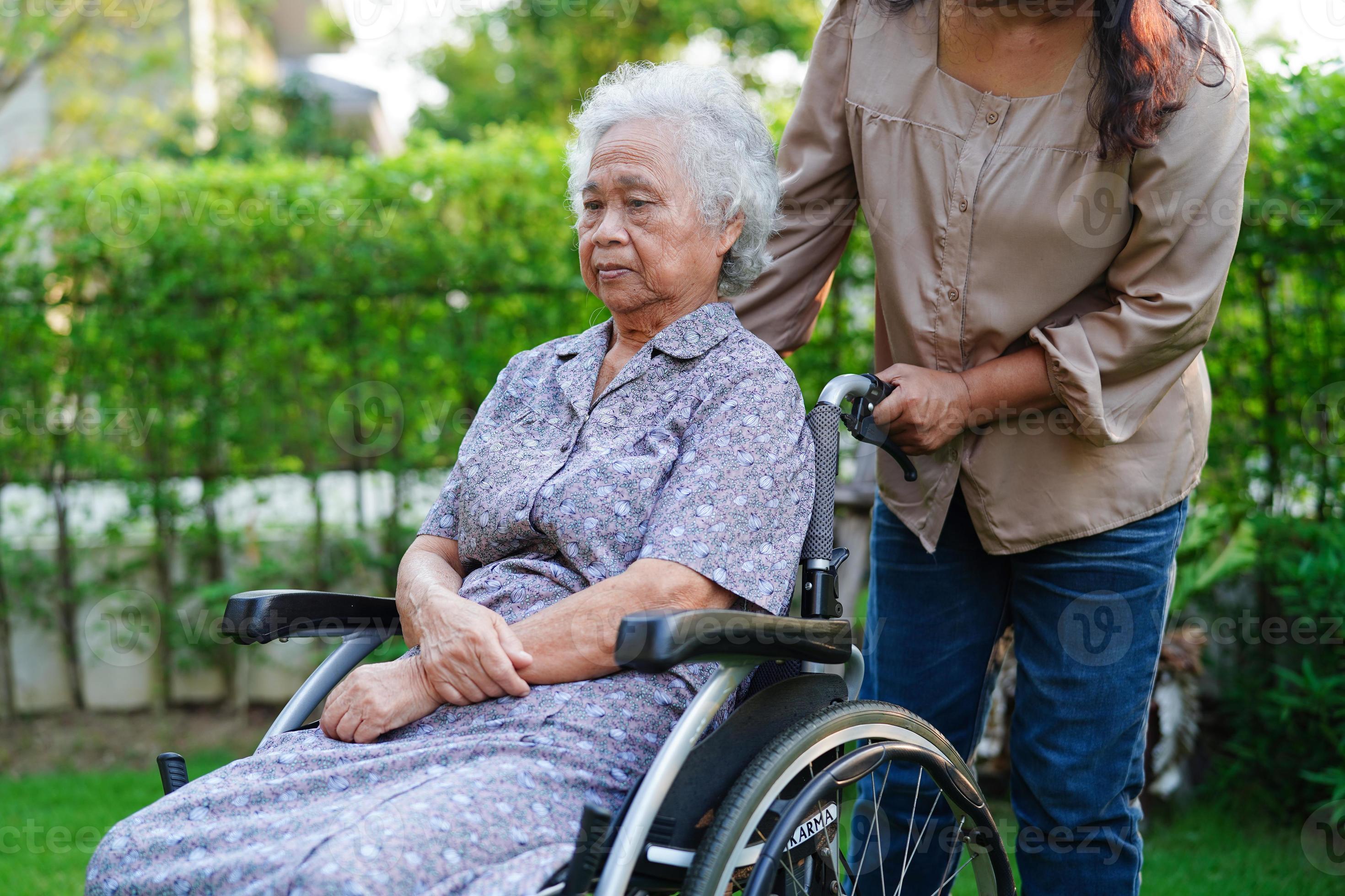 Caregiver Help Asian Elderly Woman Disability Patient Sitting On
