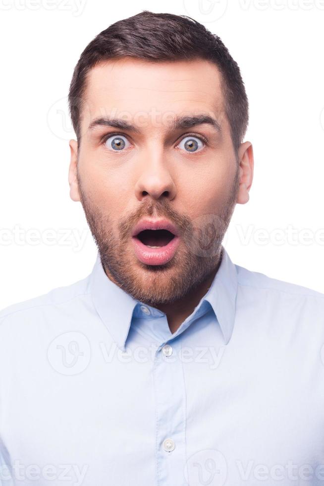 Shocking news. Portrait of surprised young man in shirt staring at ...